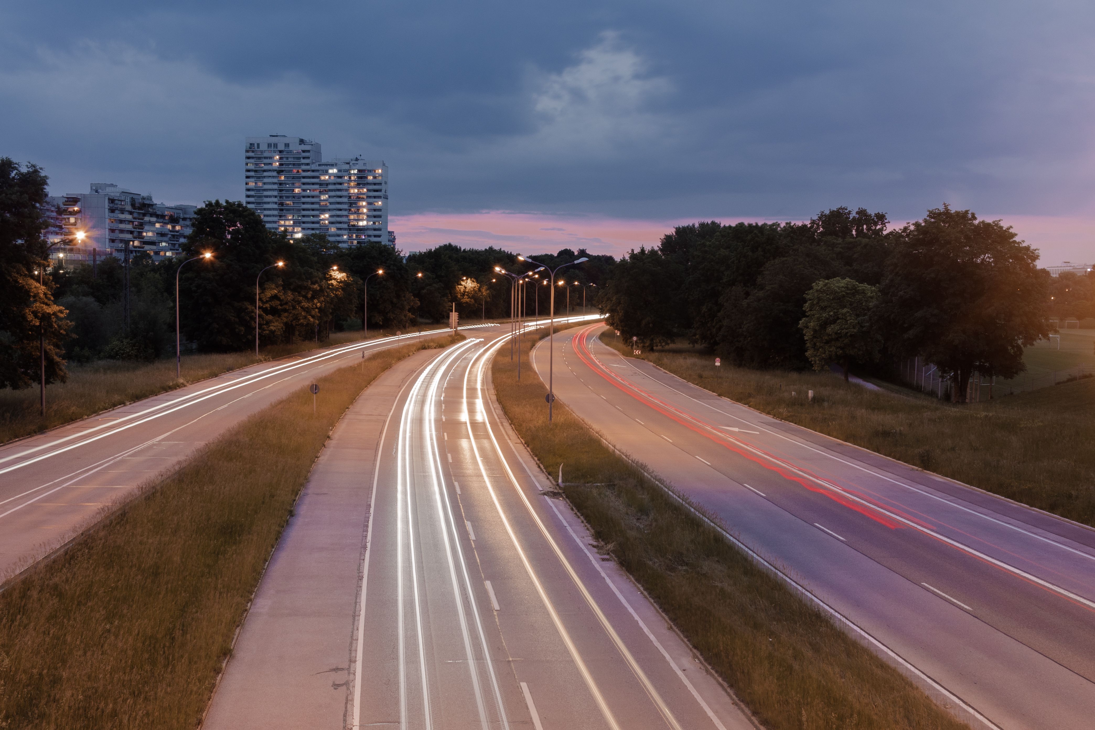 Small Town by the Highway Among Green Mountains · Free Stock Photo