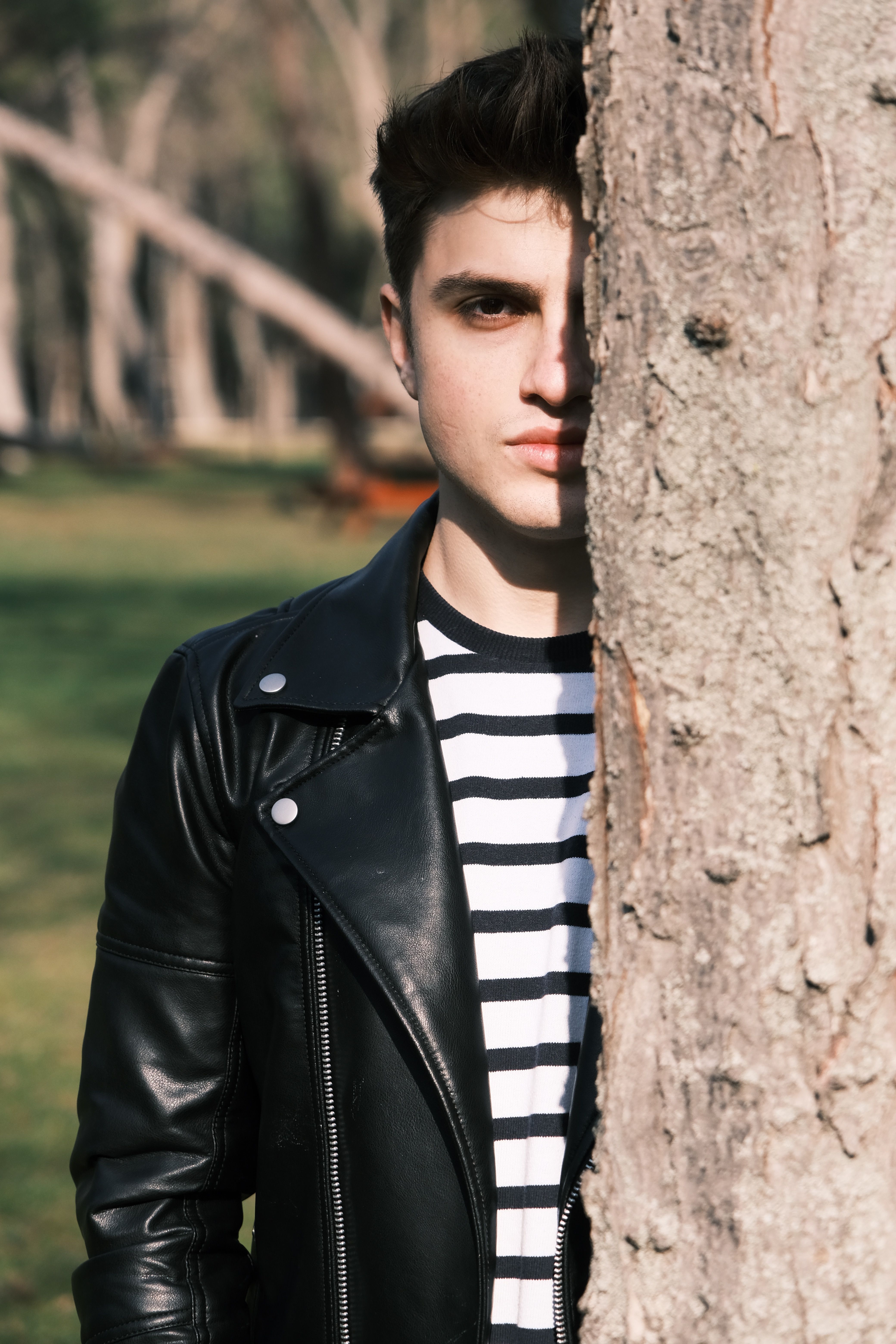 Man Standing behind Tree · Free Stock Photo