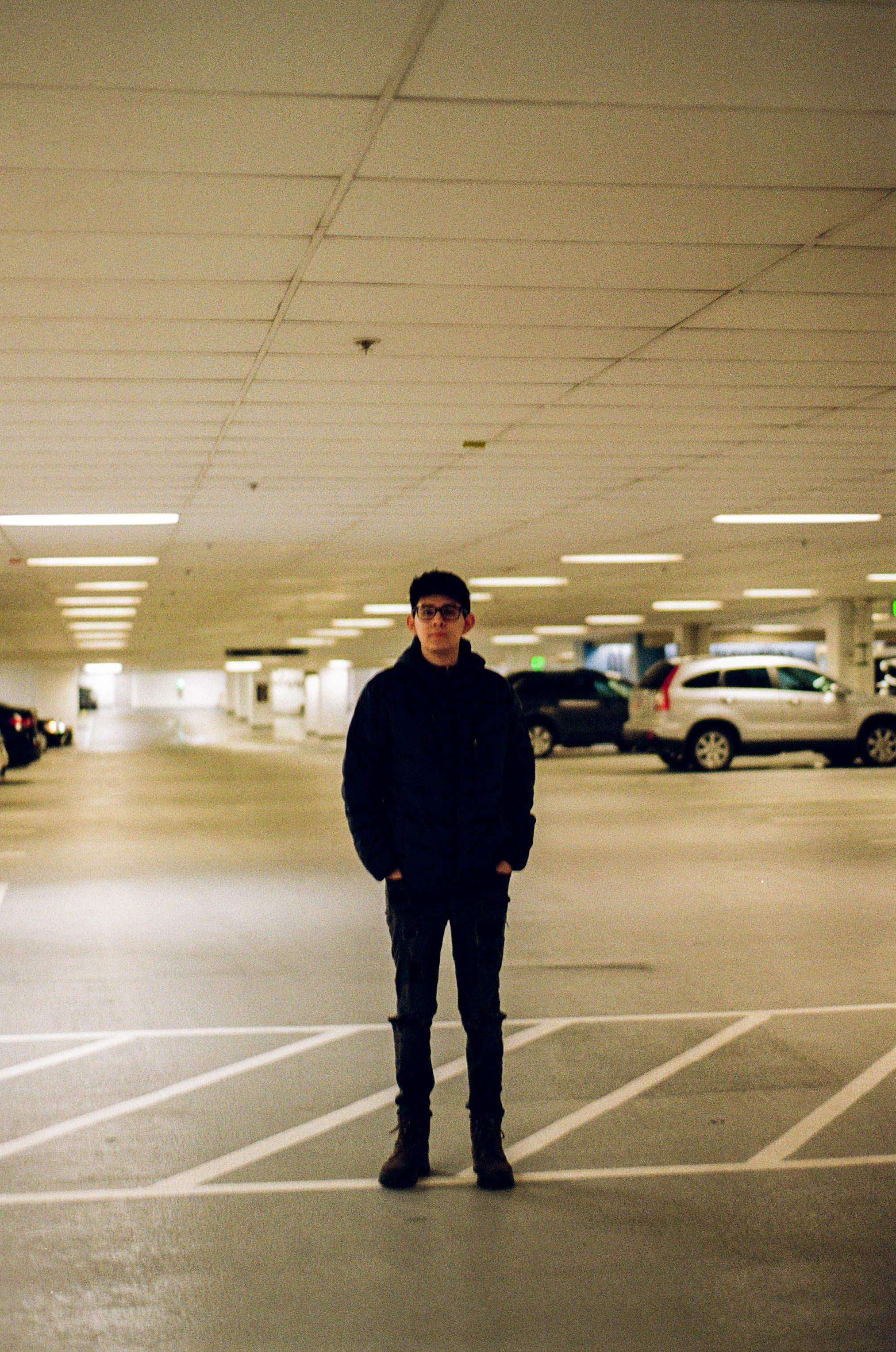 Man Standing on Parking Lot · Free Stock Photo