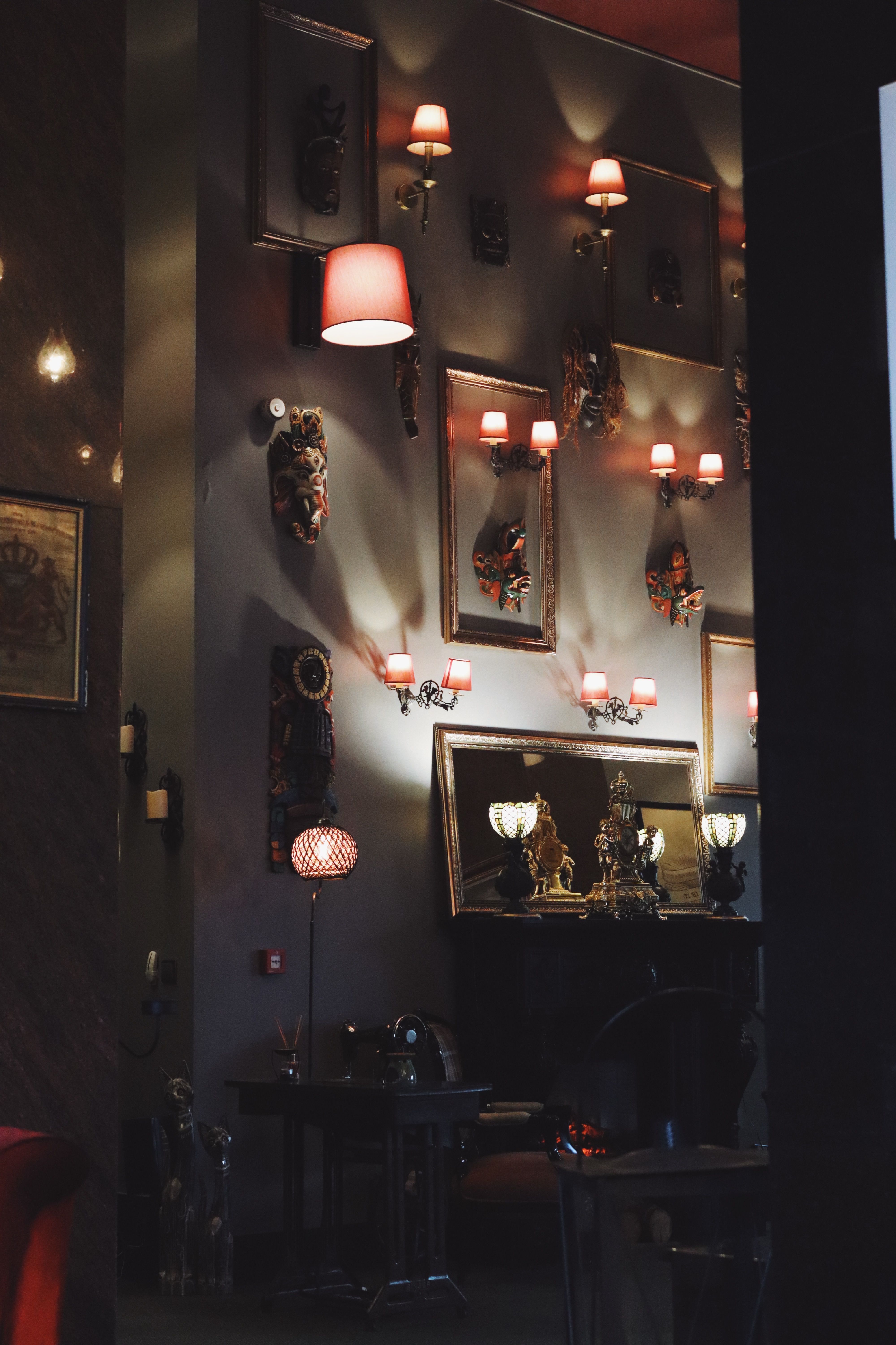 Lamps and Frames on Wall in Dark · Free Stock Photo