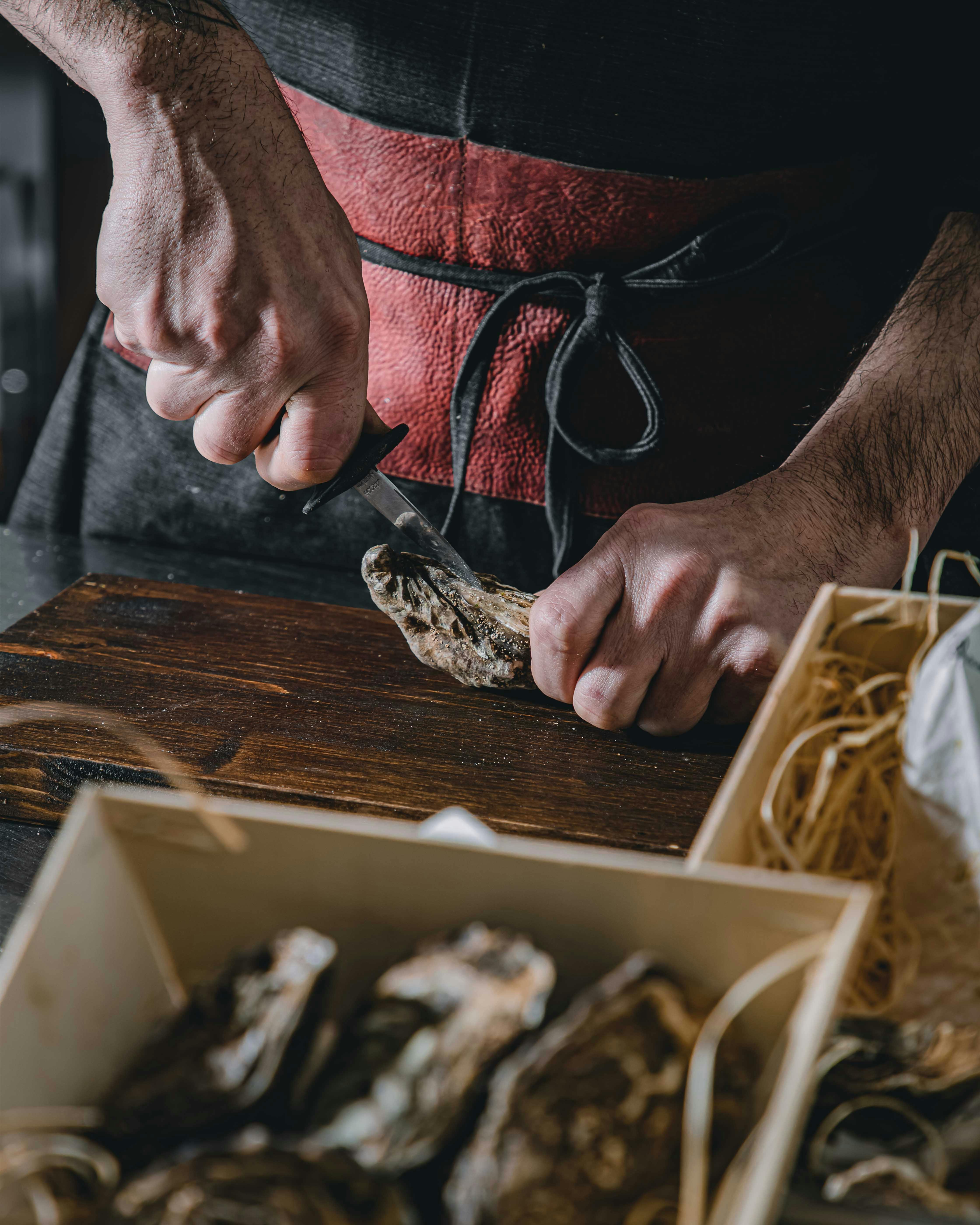 Close-up of a Chef Slicing Food · Free Stock Photo