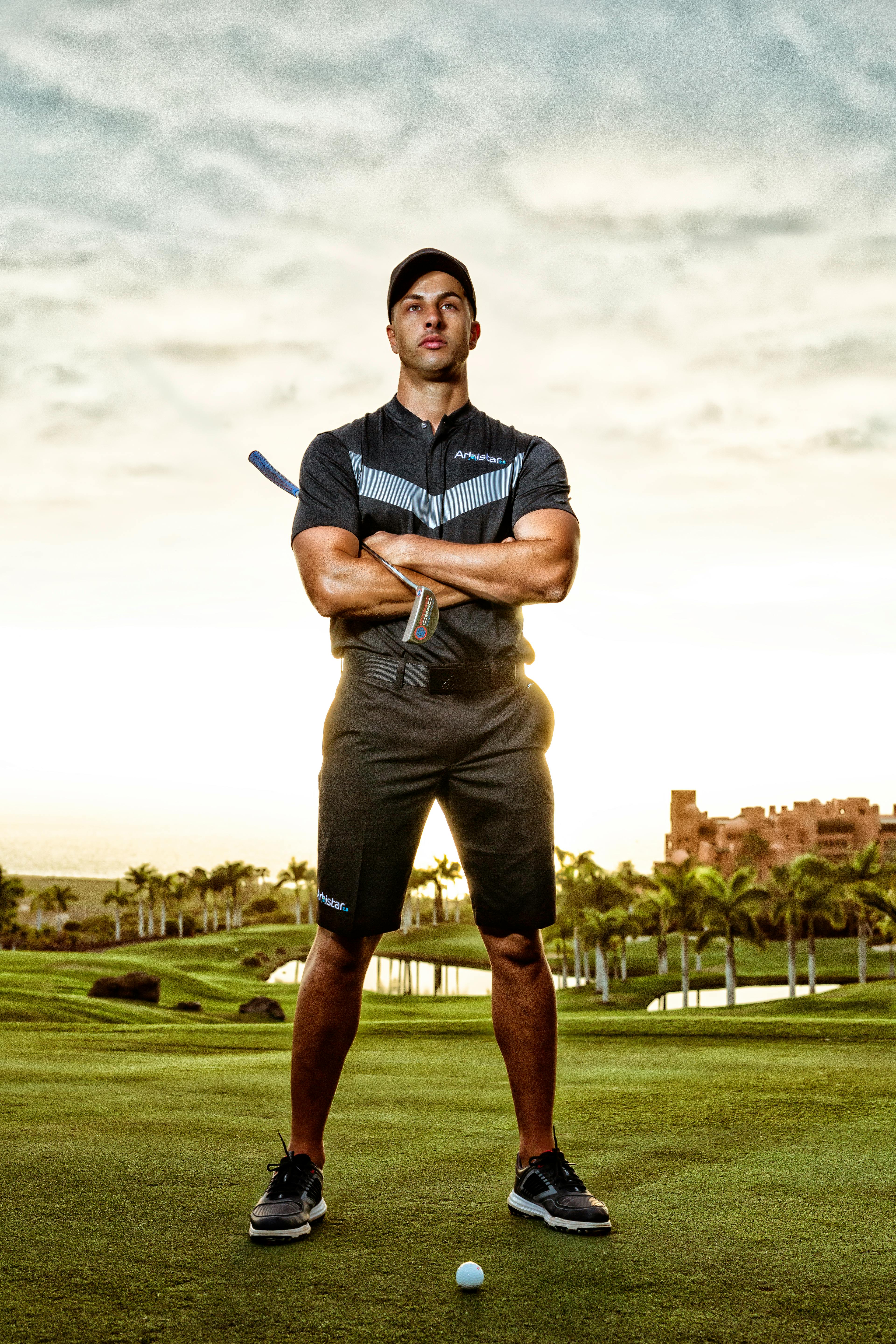 Man Posing on Golf Course · Free Stock Photo