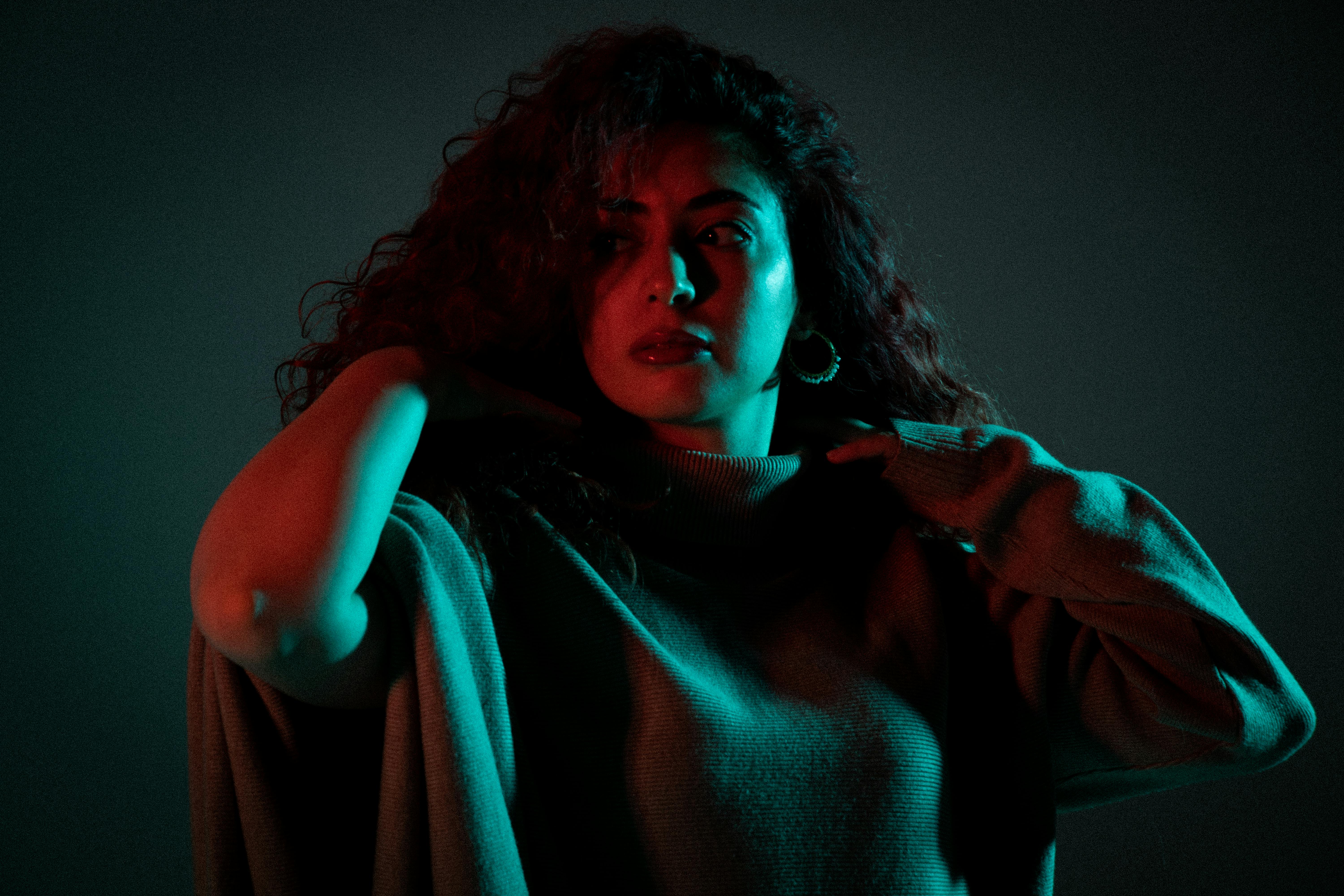 Beautiful Woman Posing in Dark · Free Stock Photo