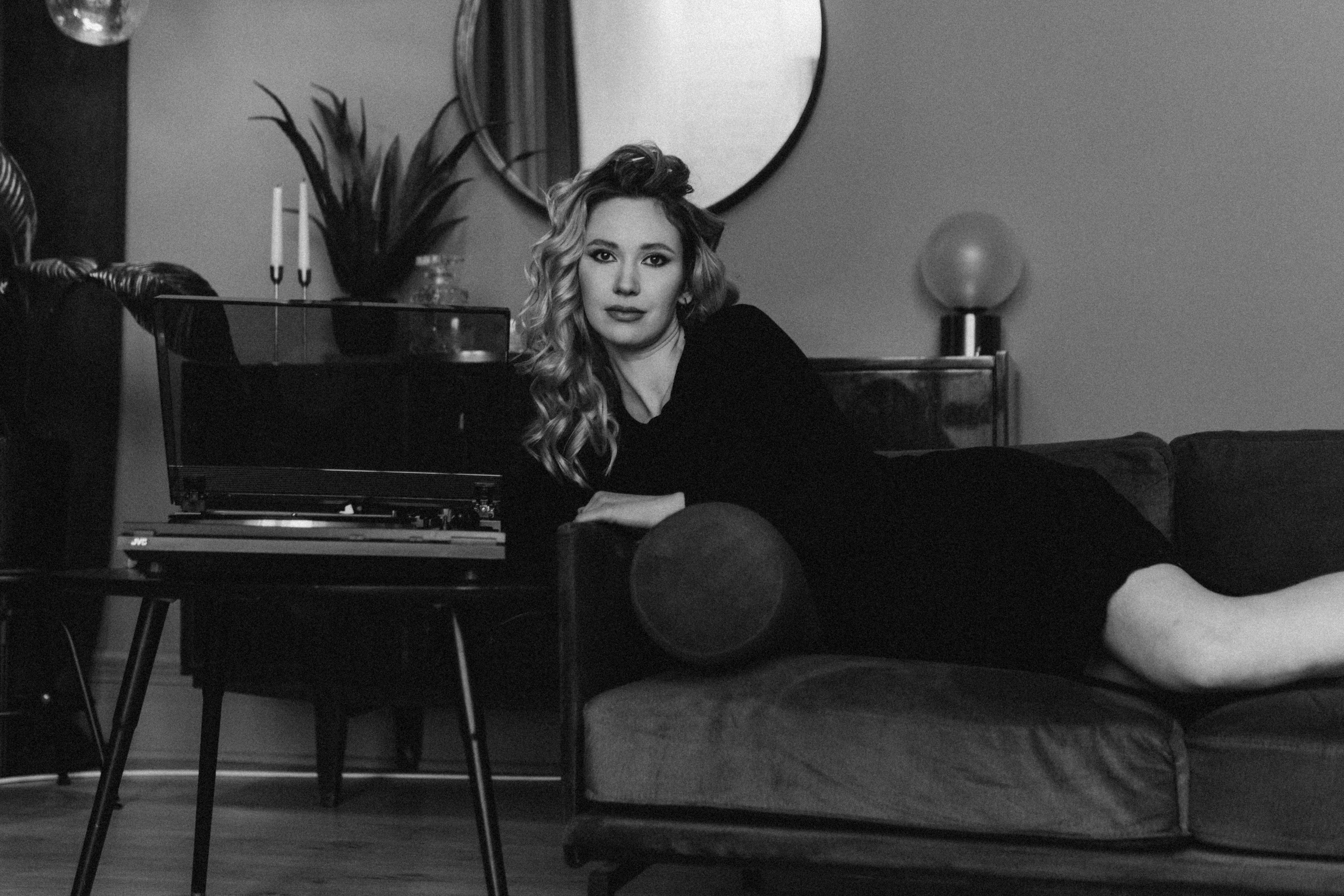 Sexy Woman Lying on Sofa Indoors · Free Stock Photo