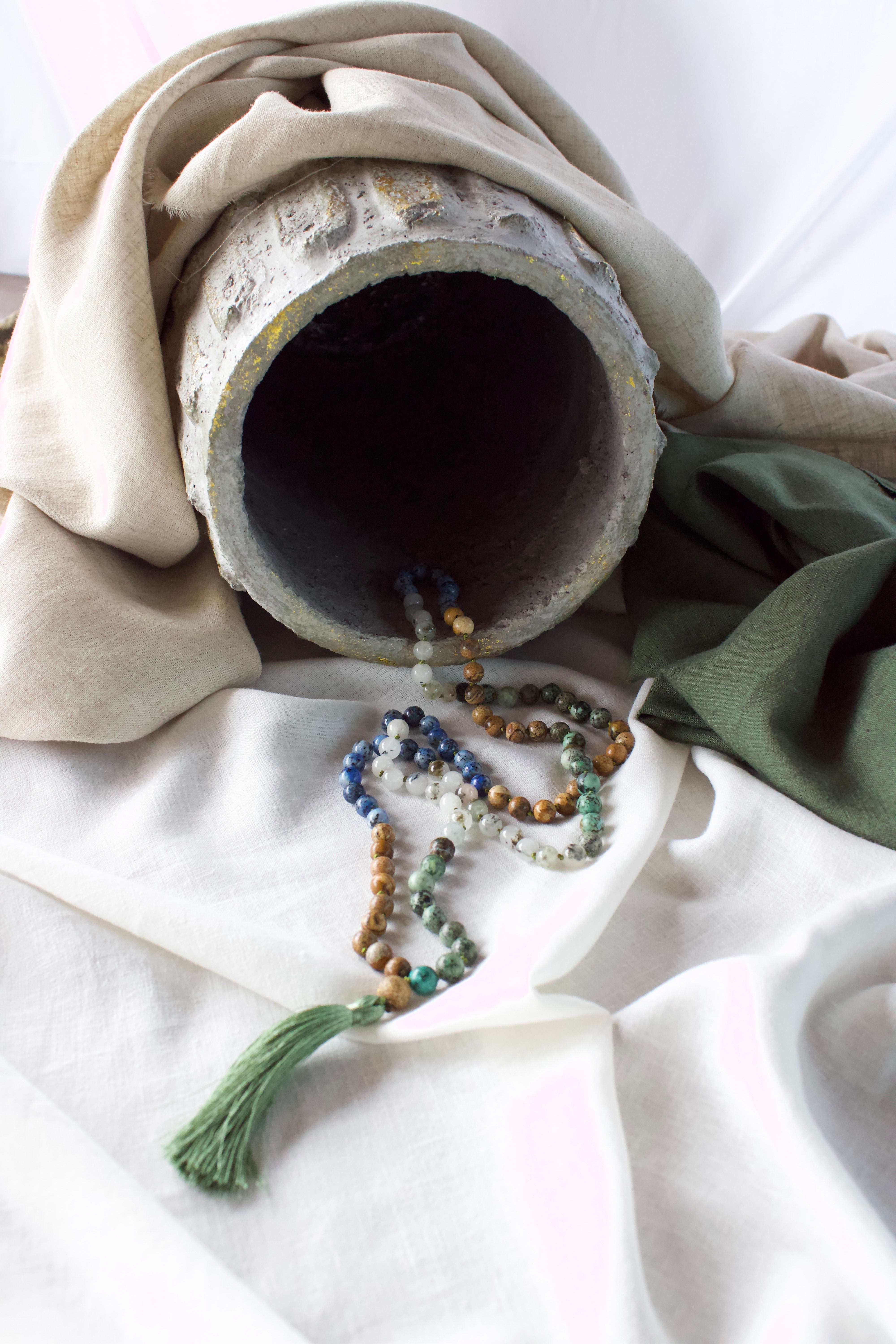 Close Up Photo of Beaded Accessories on Gray Surface · Free Stock Photo