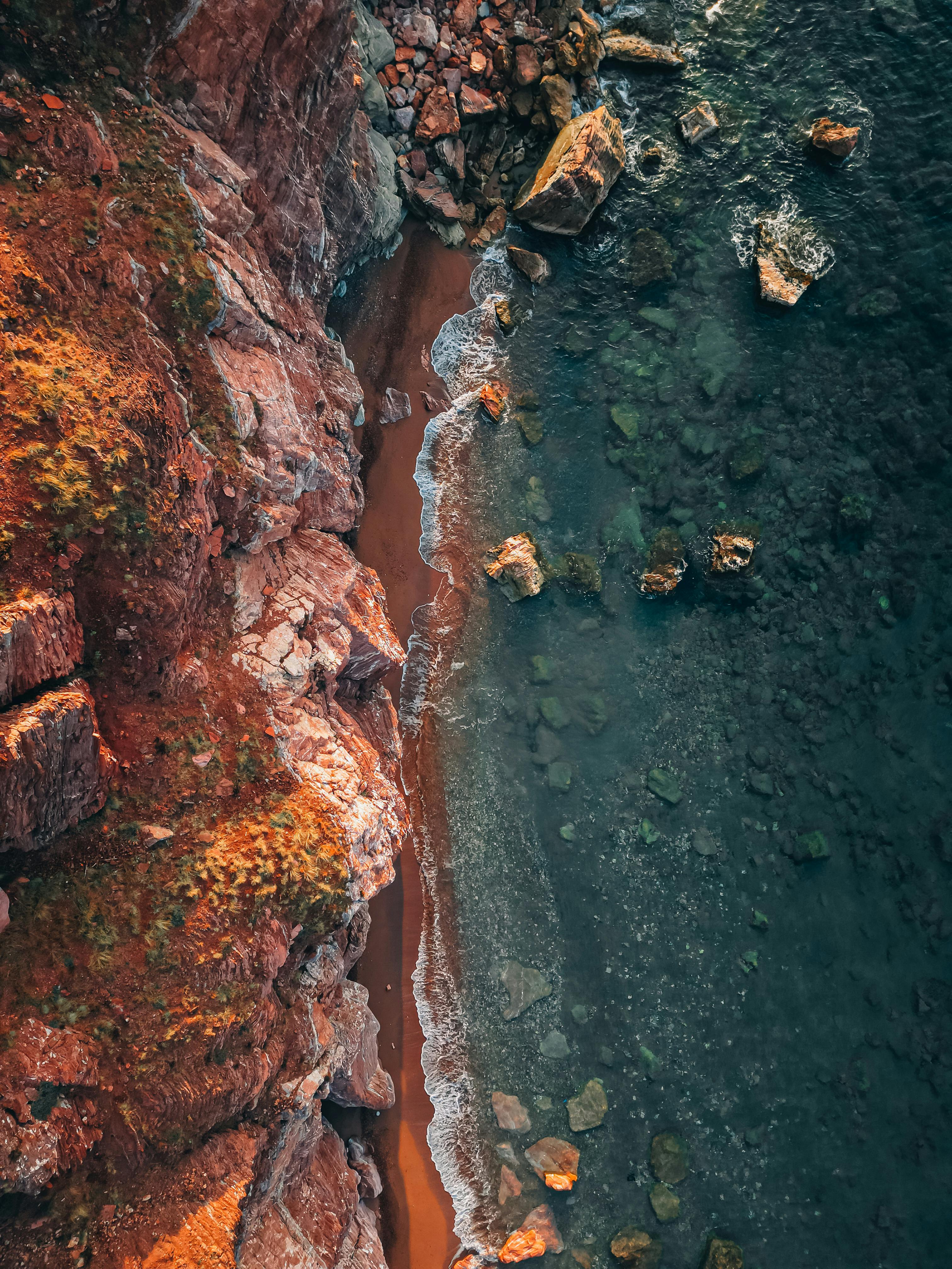 Top View of Rocks on Sea Shore · Free Stock Photo
