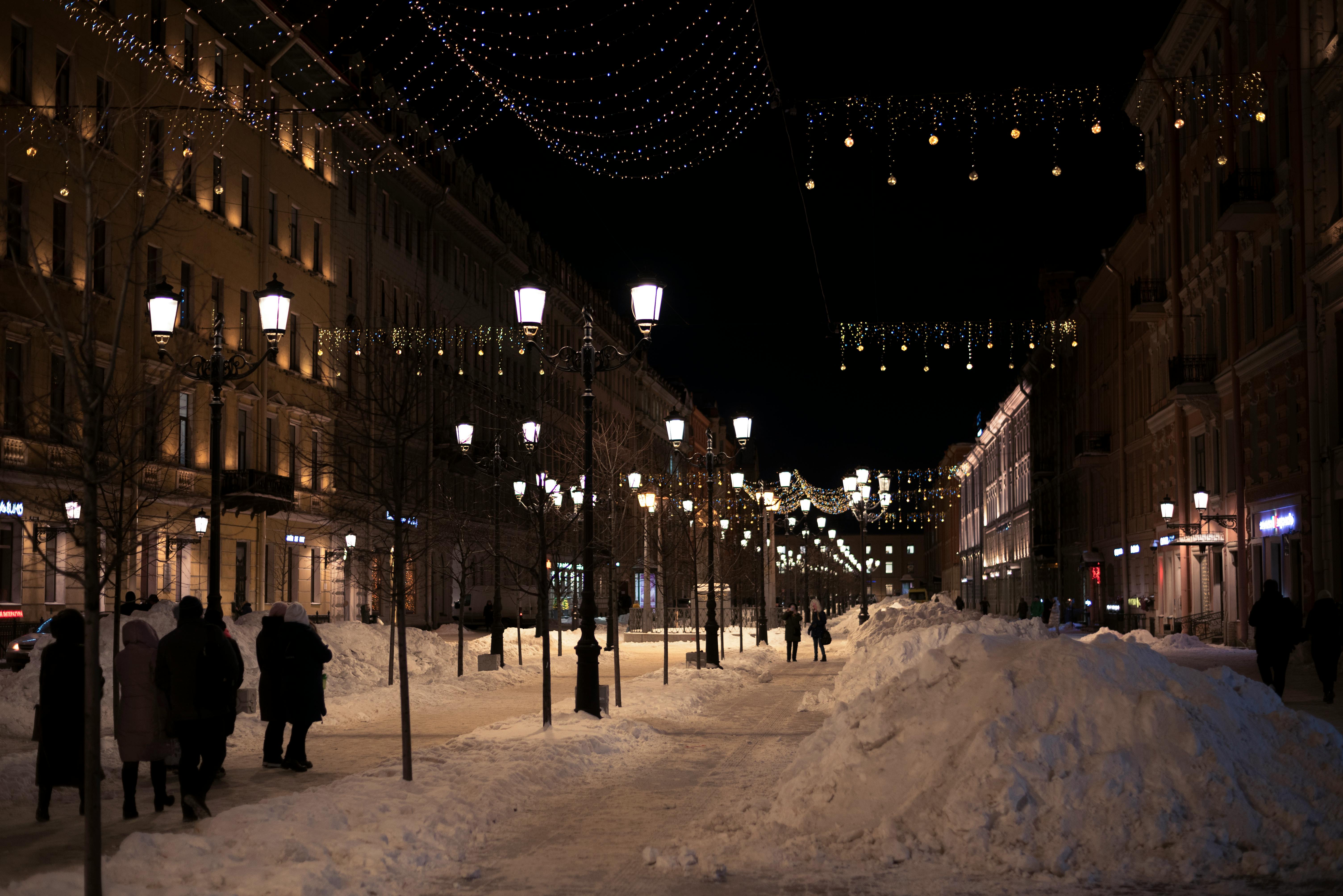 People Walking on Snowed Street at Night · Free Stock Photo