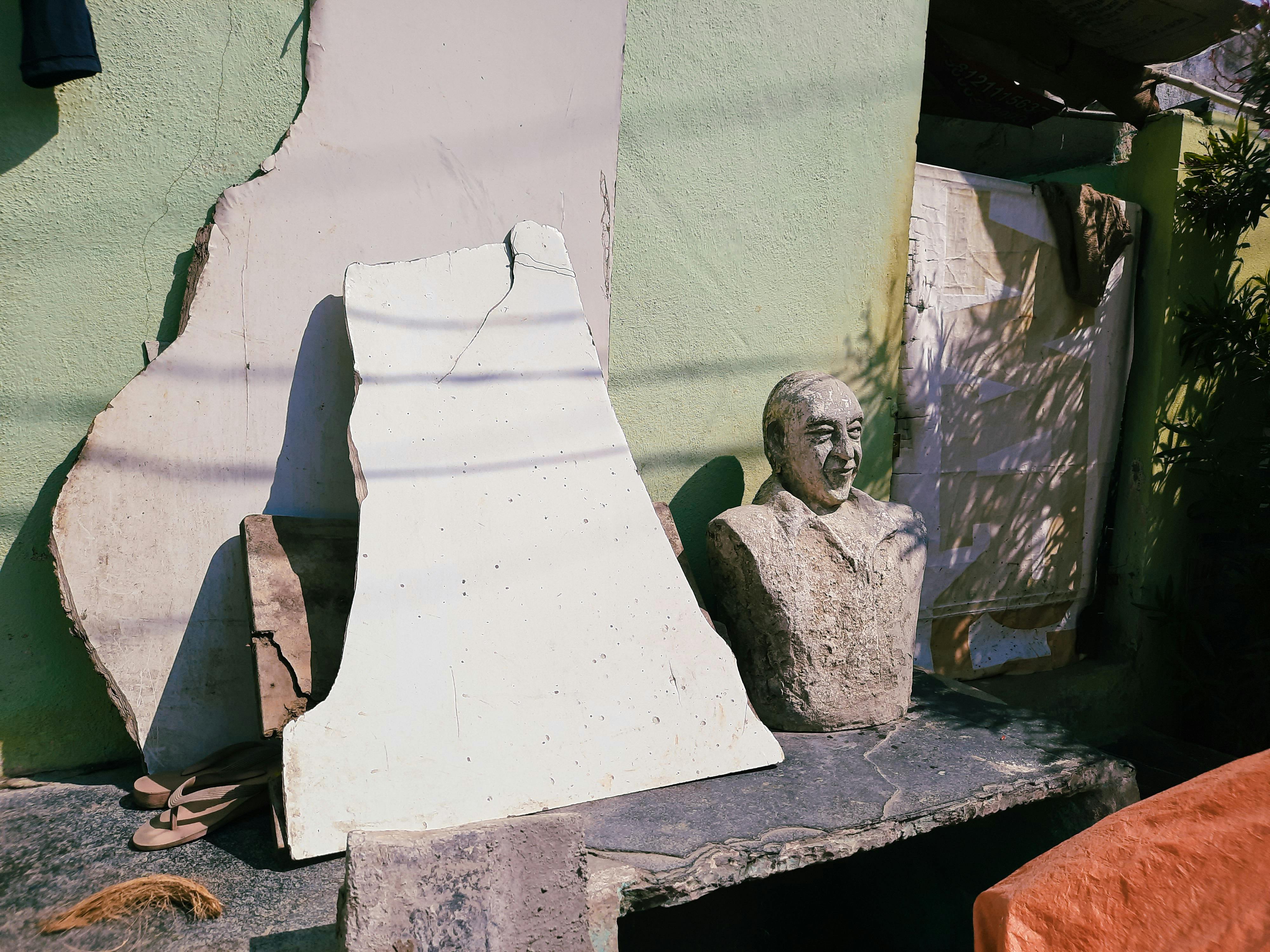 Bust Sculpture Left by Chipped Wall · Free Stock Photo