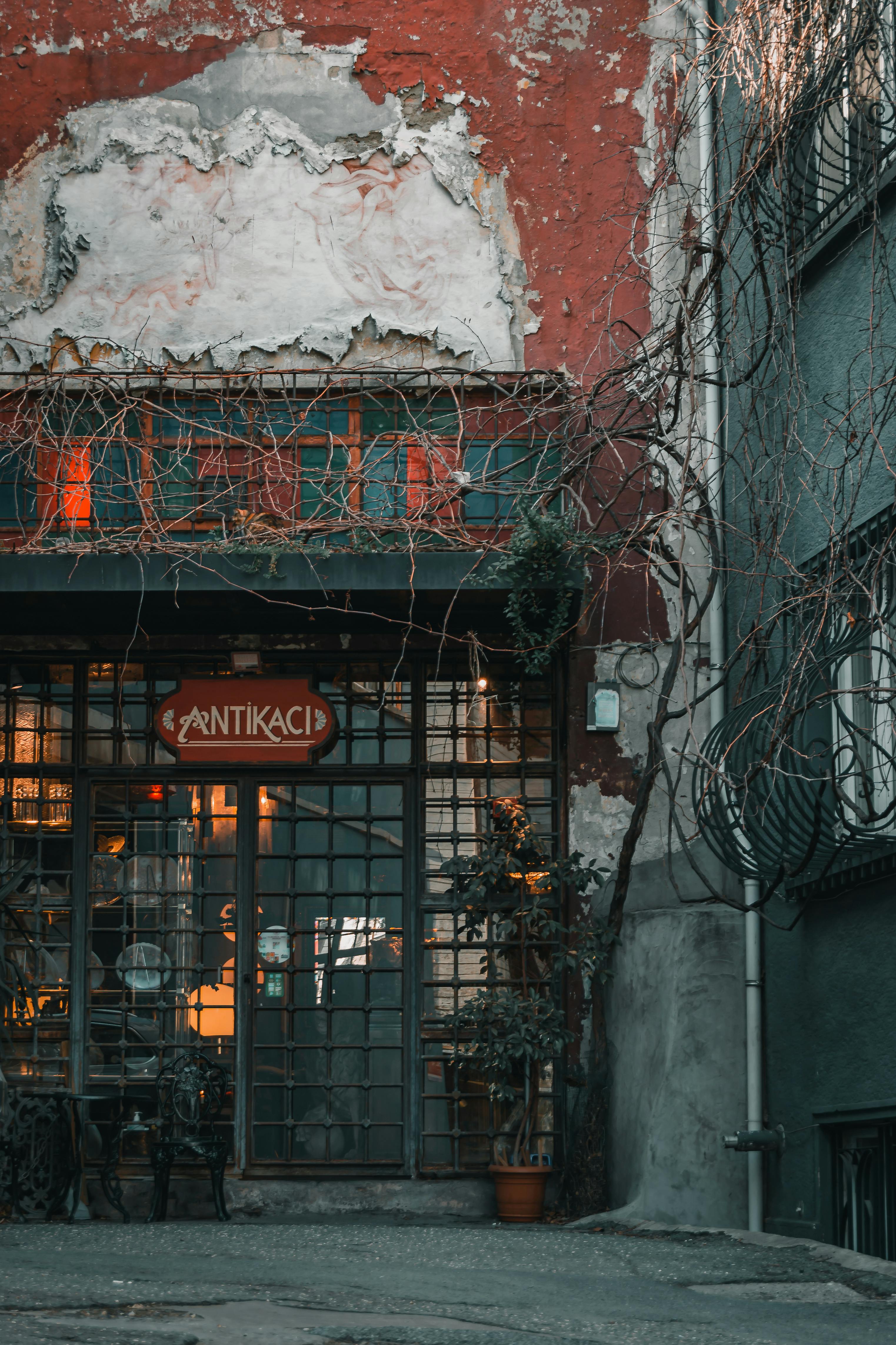 Photo of a Vintage Shop Entrance in a Weathered Building · Free Stock Photo