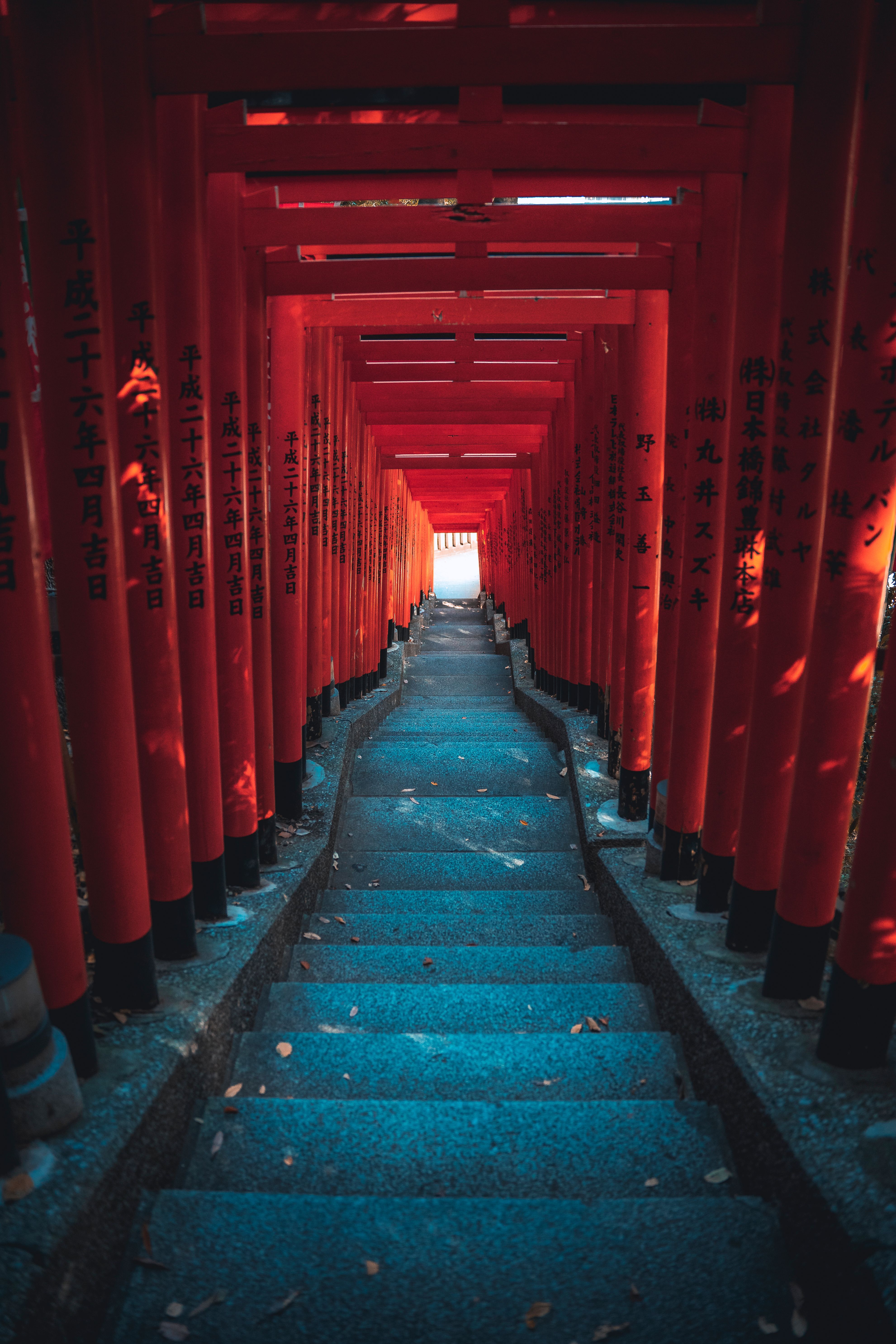 Tunnel of Red Wooden Poles and Stairs · Free Stock Photo