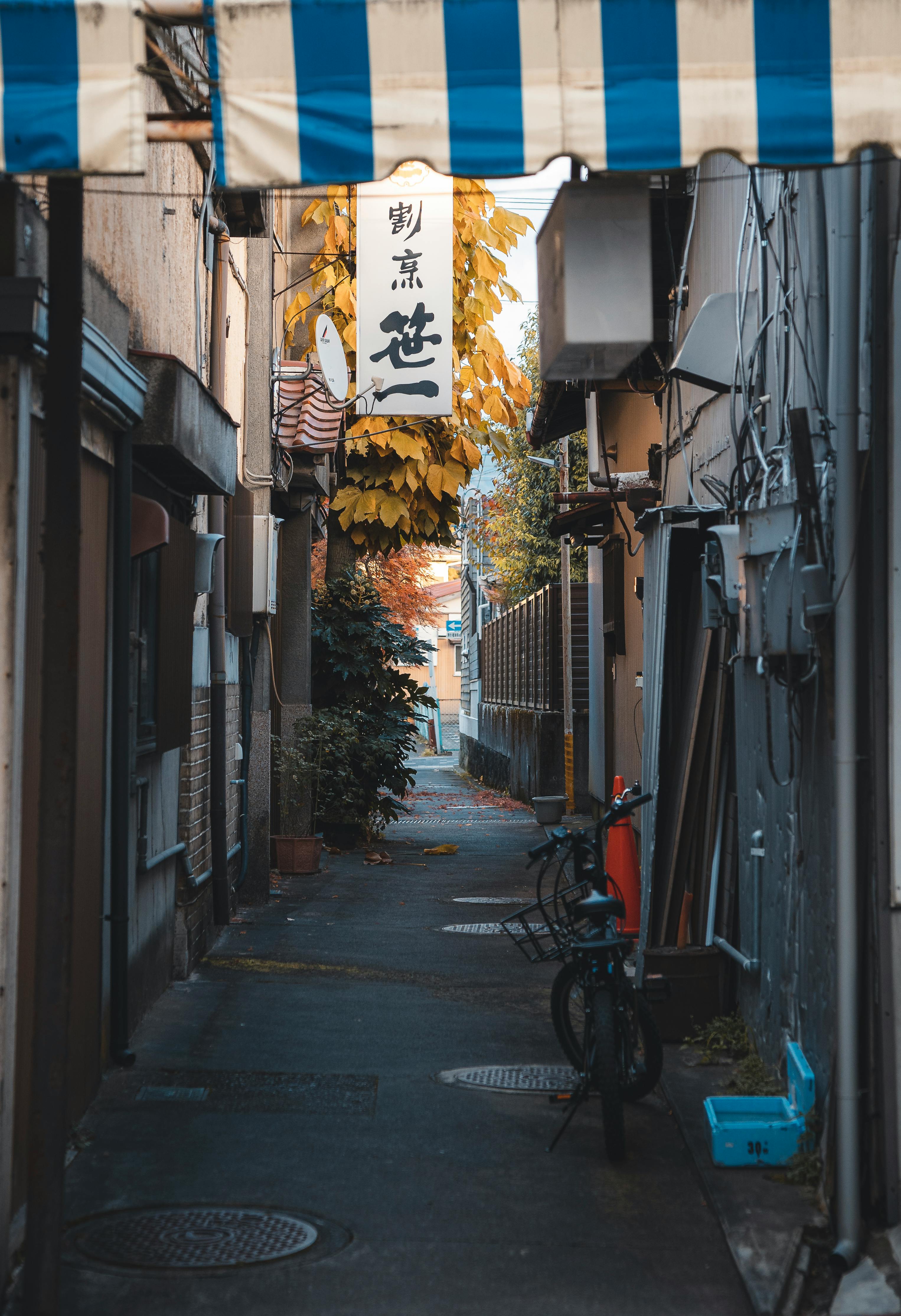 A Narrow Alley between Buildings in City · Free Stock Photo