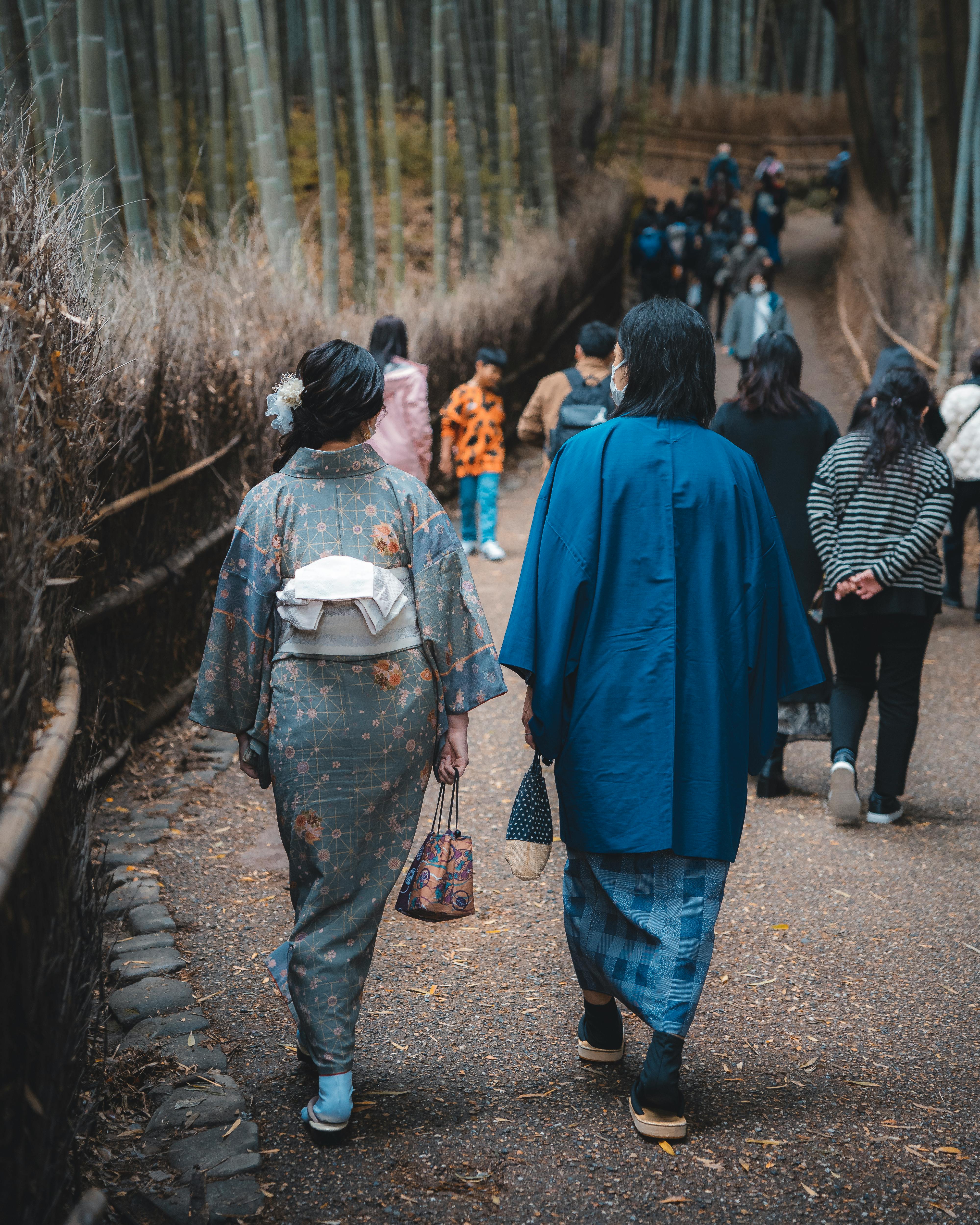 Three Geisha Walking Between Buildings · Free Stock Photo