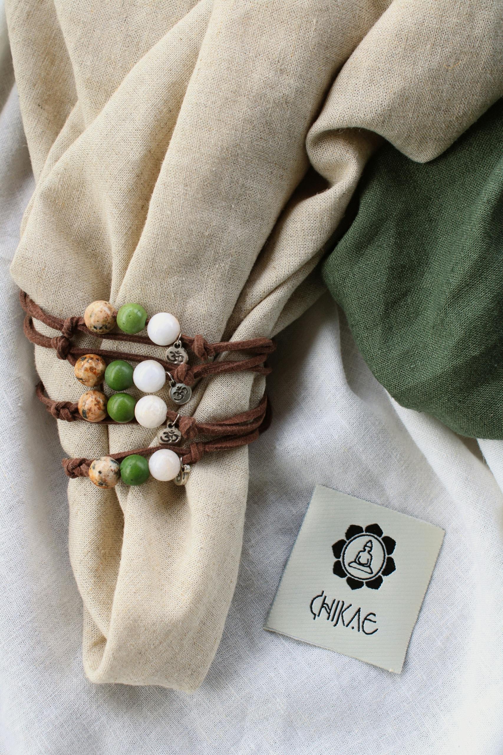 Close Up Photo of Beaded Accessories on Gray Surface · Free Stock Photo