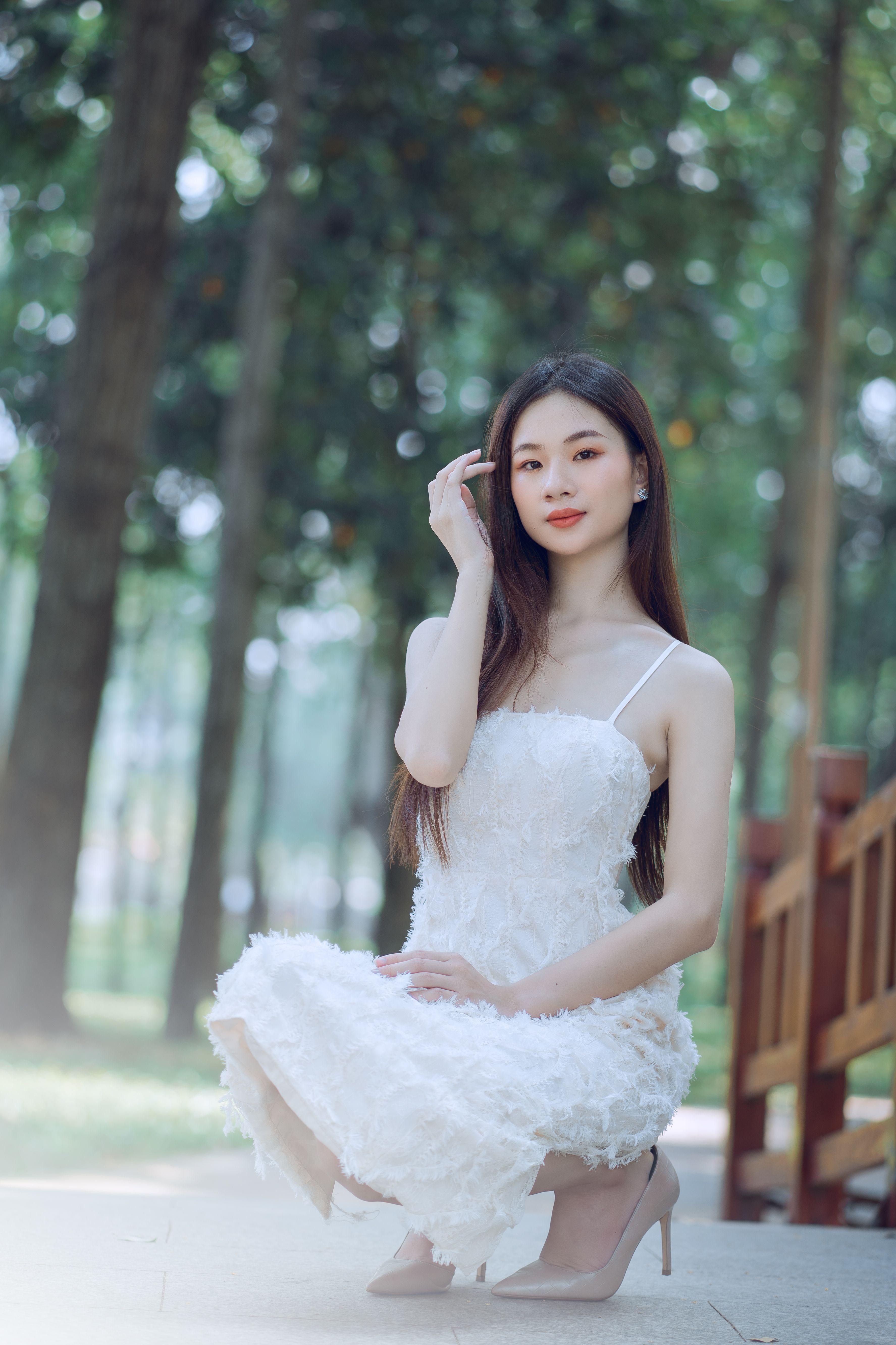 Crouching Woman in a Dress and High Heels · Free Stock Photo