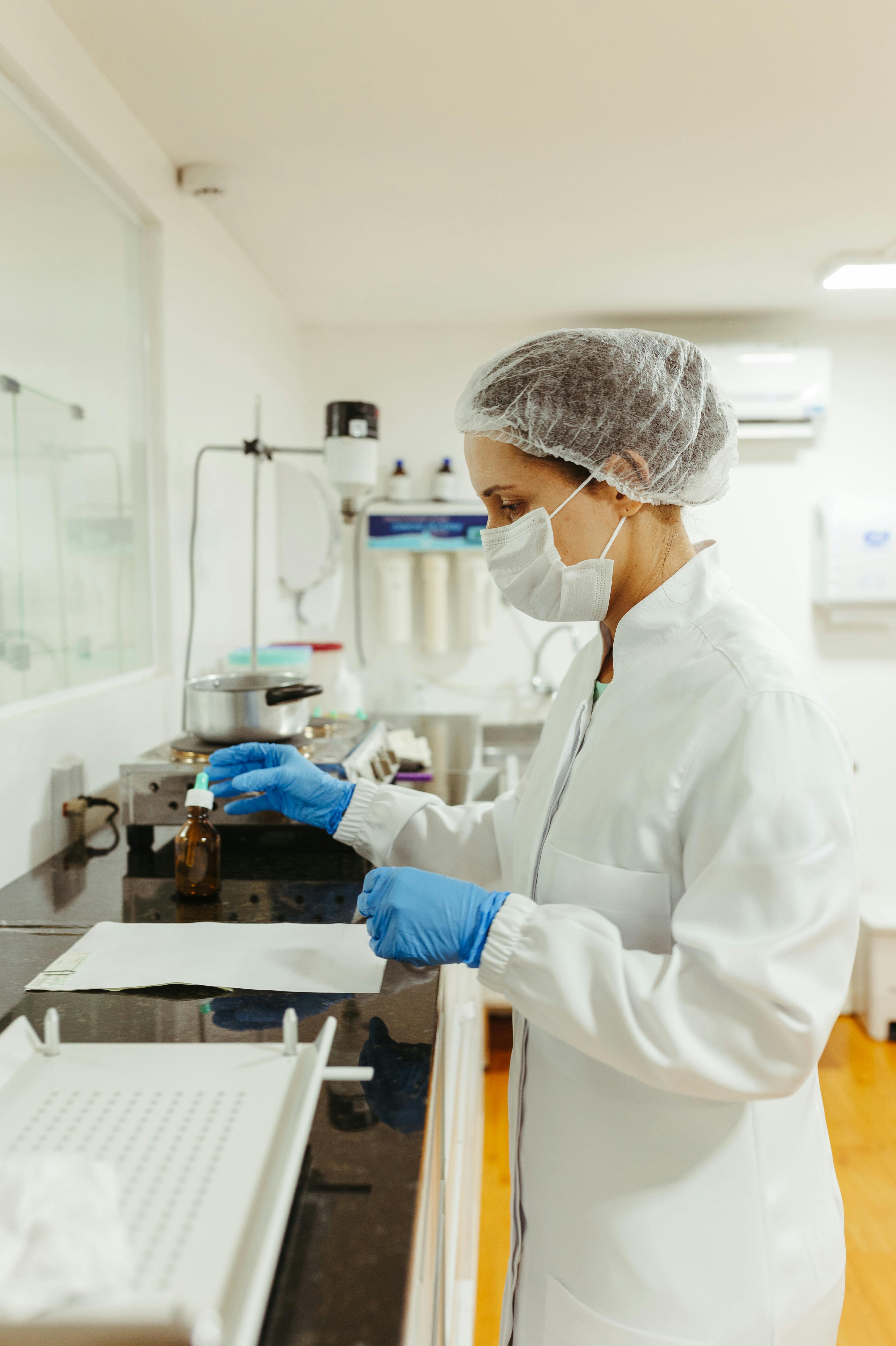 Person in Lab Coat looking through Files · Free Stock Photo