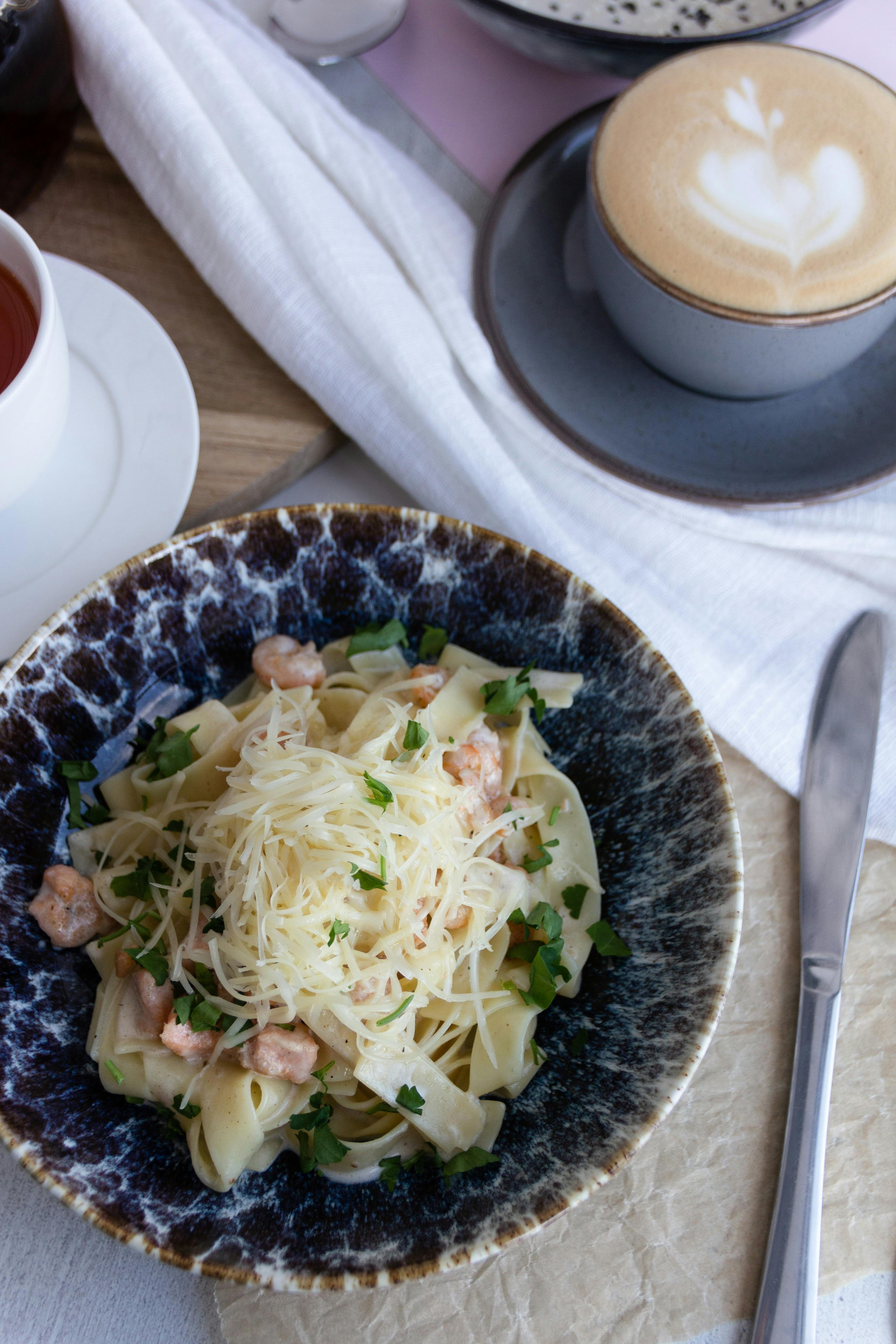 Pasta with flowers laying on plate · Free Stock Photo