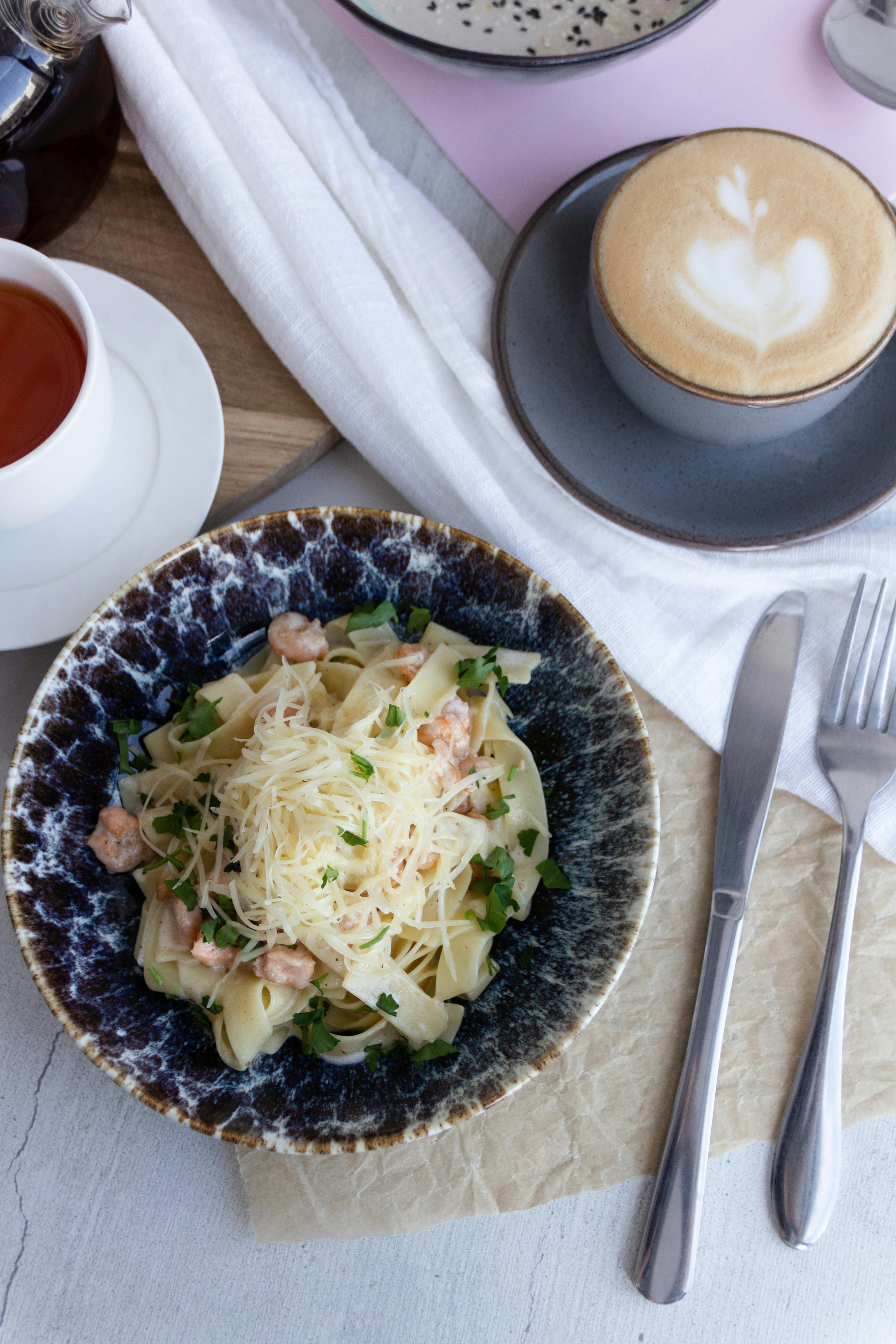 Pasta with flowers laying on plate · Free Stock Photo