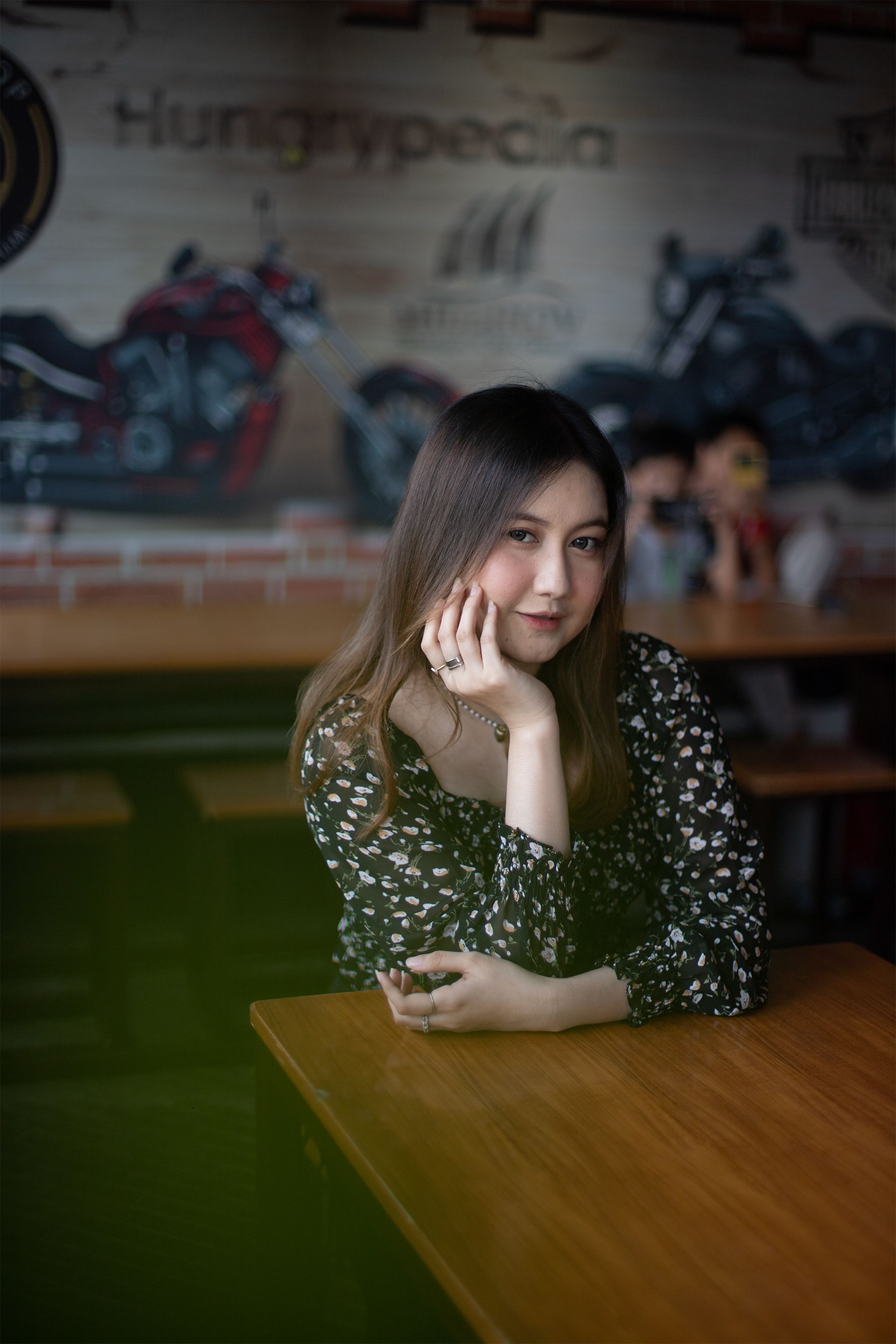 Pretty Girl Sitting at a Table · Free Stock Photo
