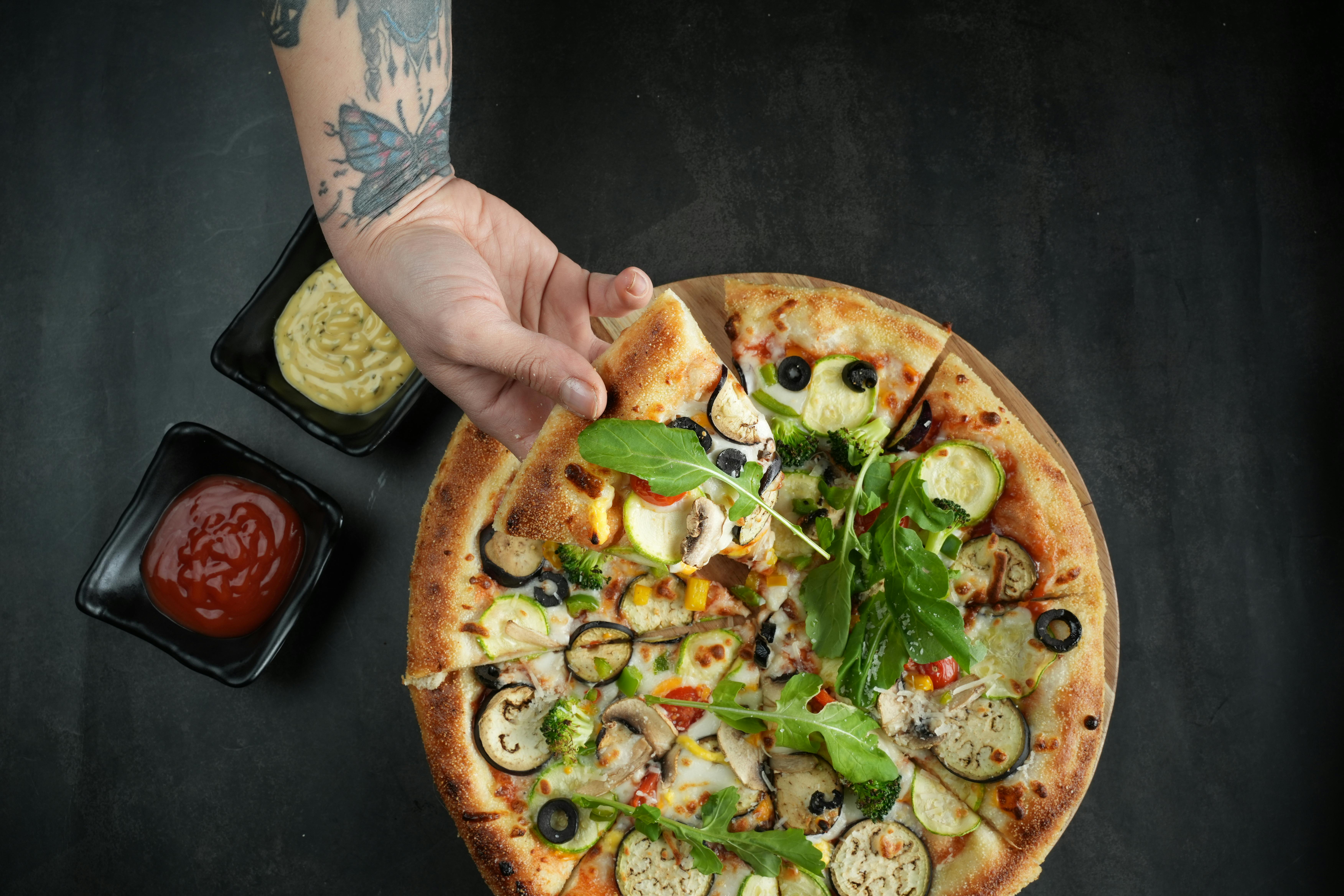 Woman Eating Pizza · Free Stock Photo