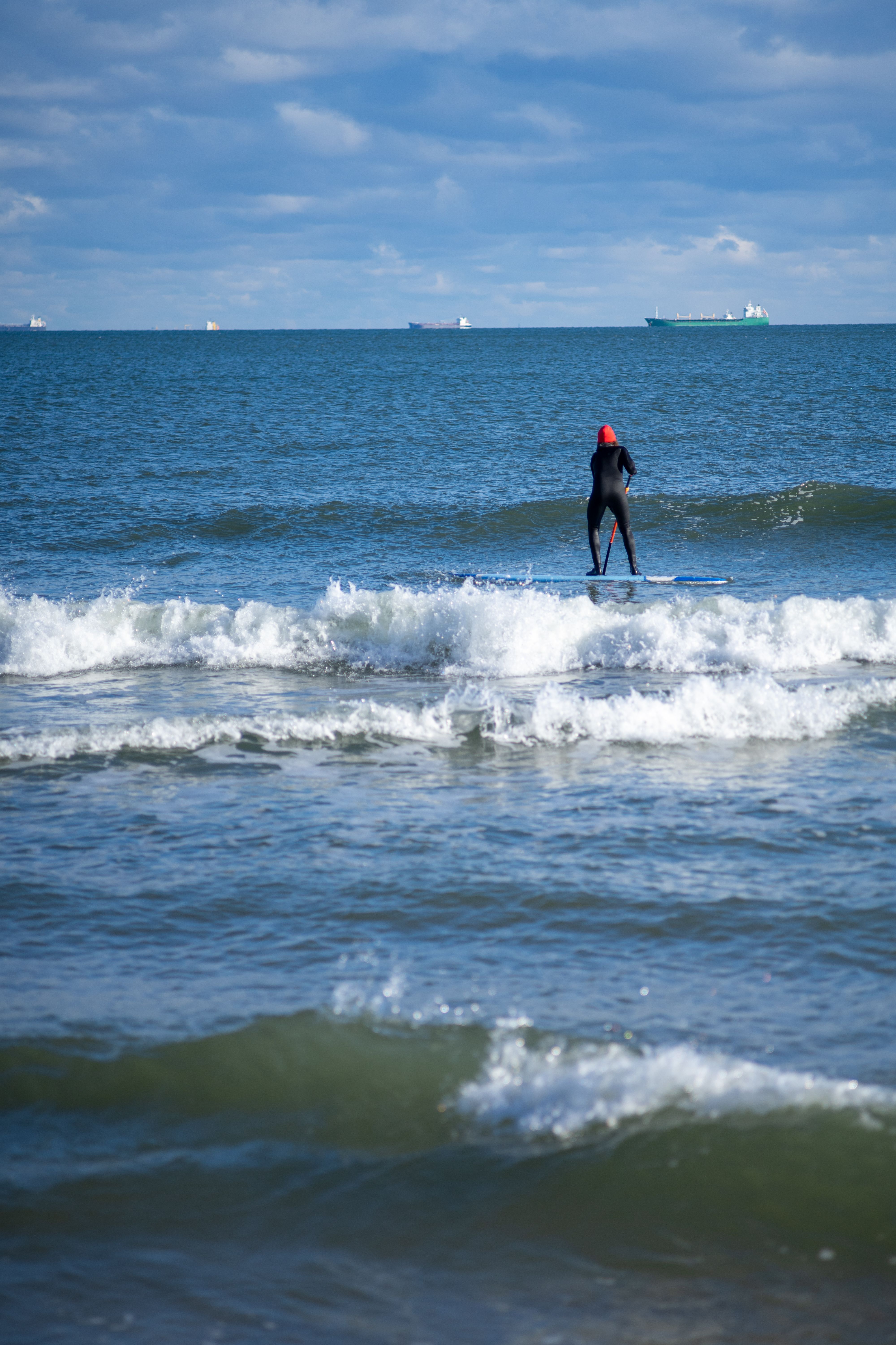 Person on Paddle Board on Sea Shore · Free Stock Photo