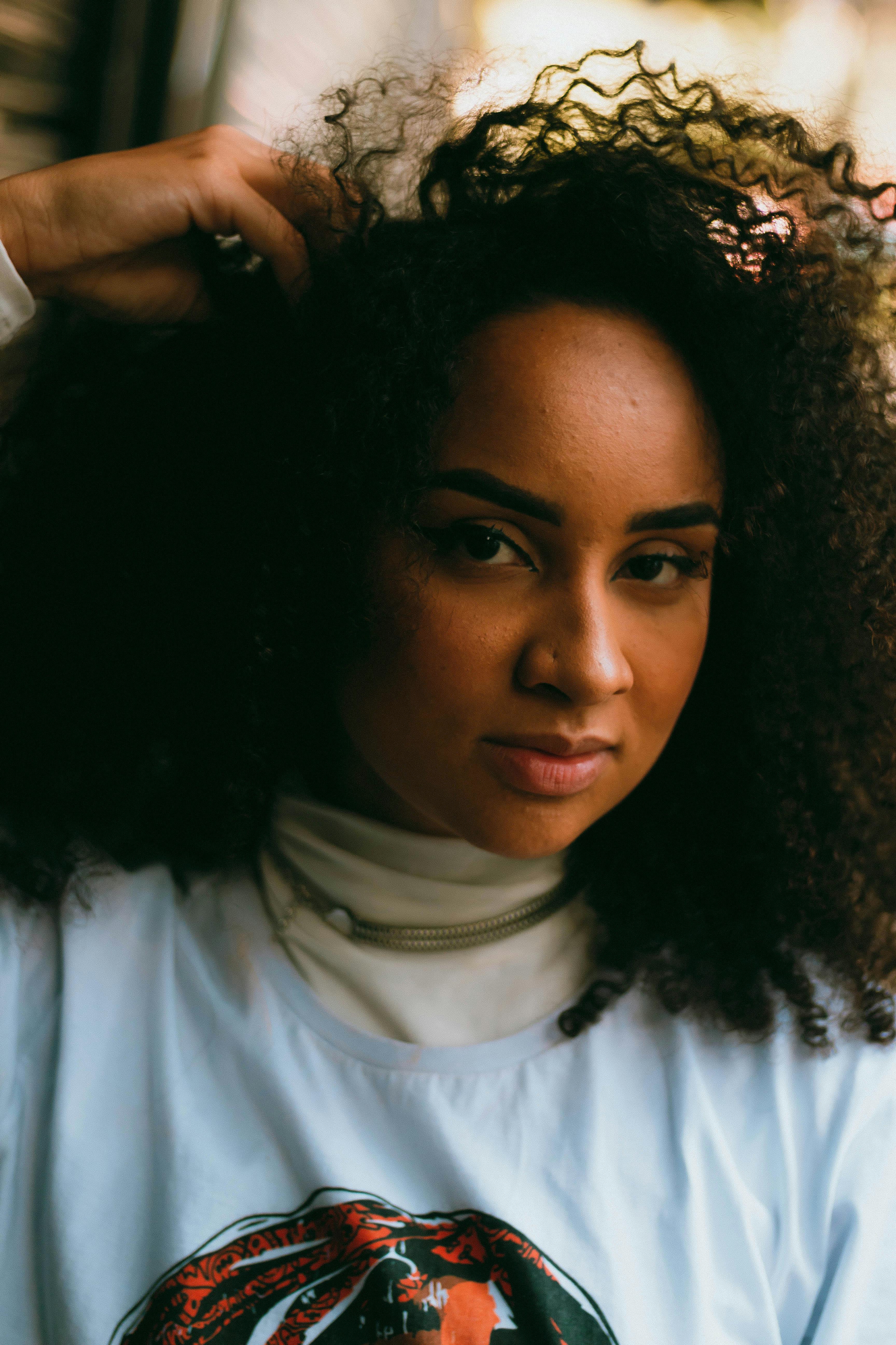 Portrait of a Woman in Dim Light · Free Stock Photo