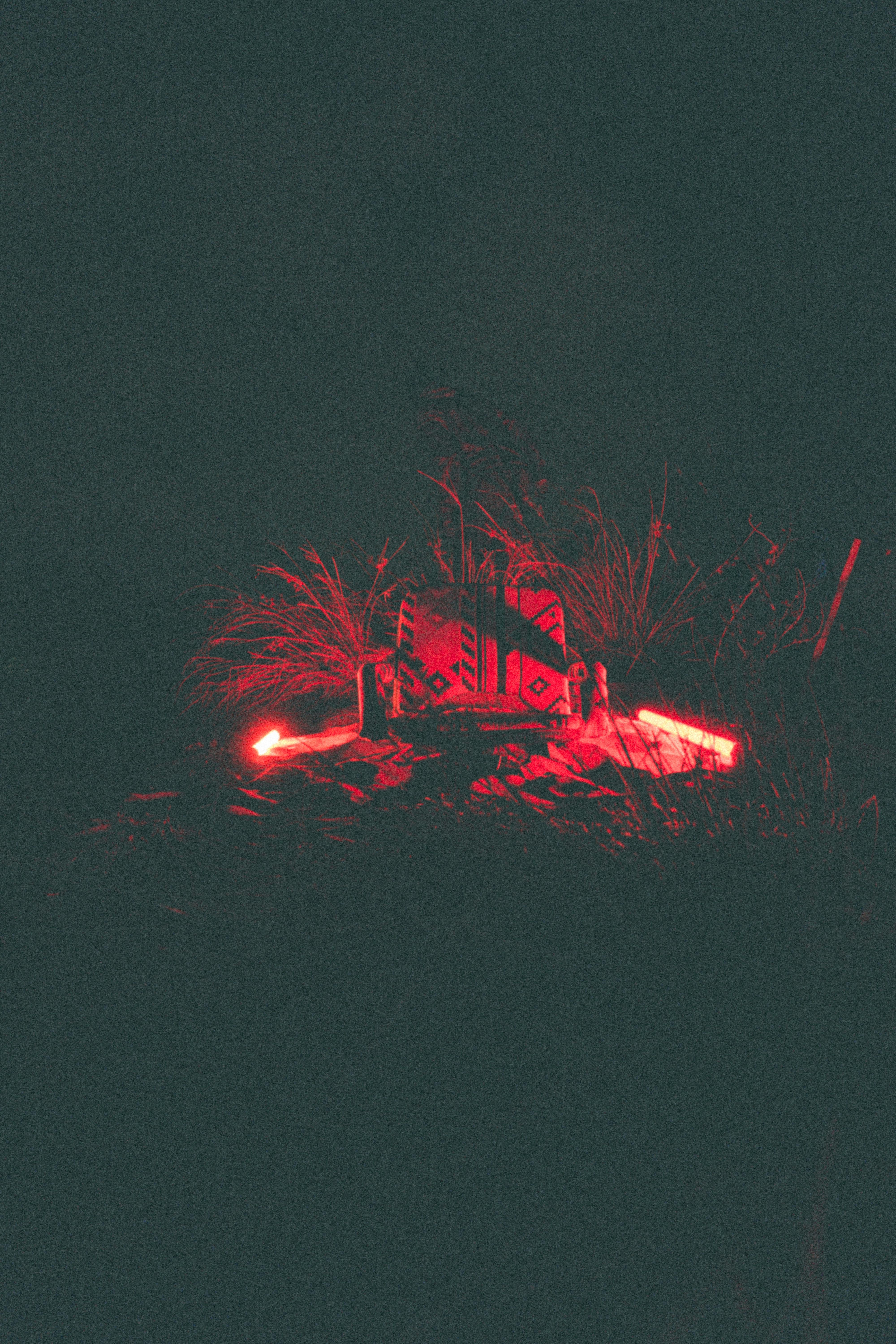 Red Light over Item on Ground at Night · Free Stock Photo