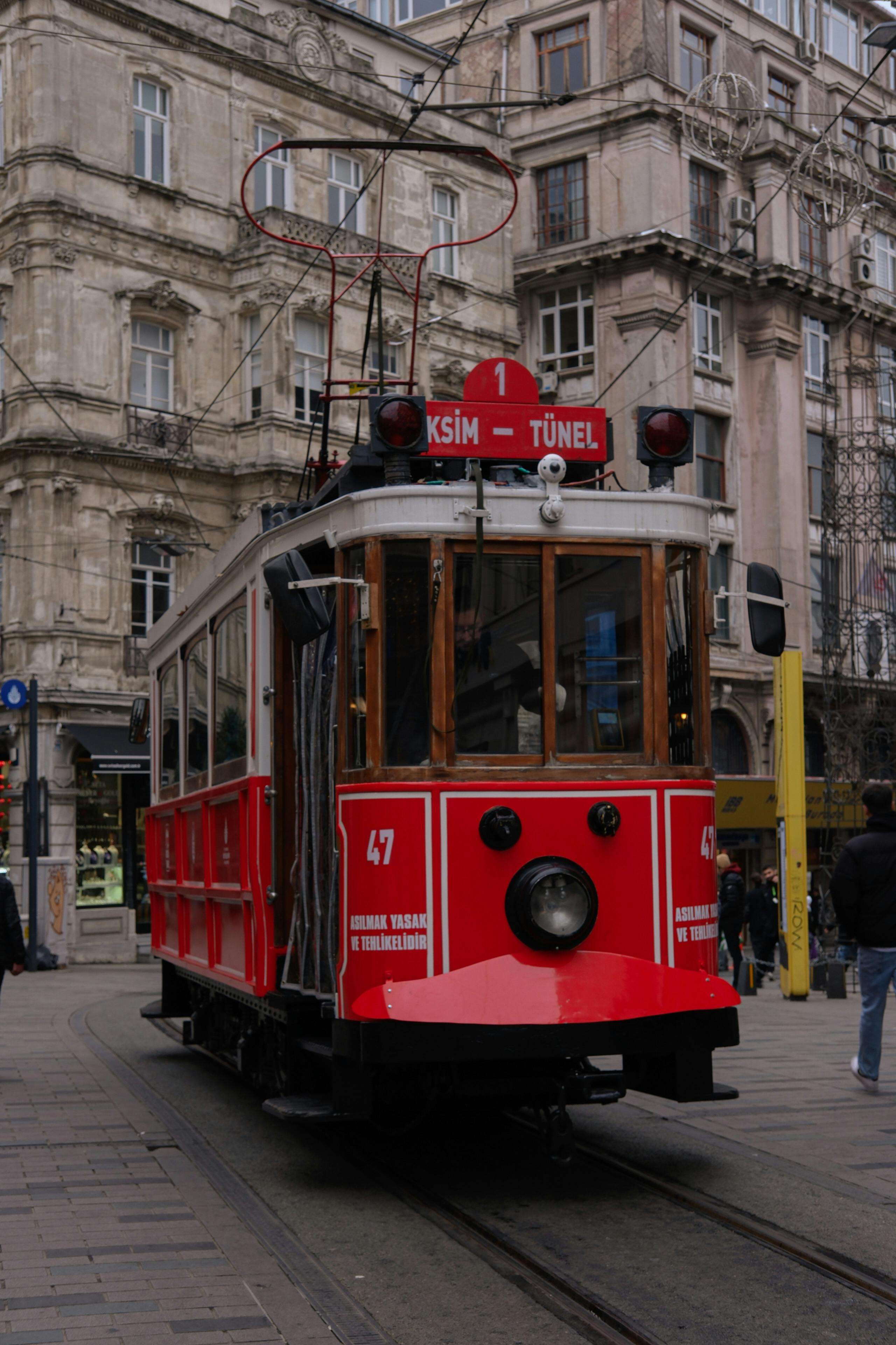 A red and white tram on the street · Free Stock Photo