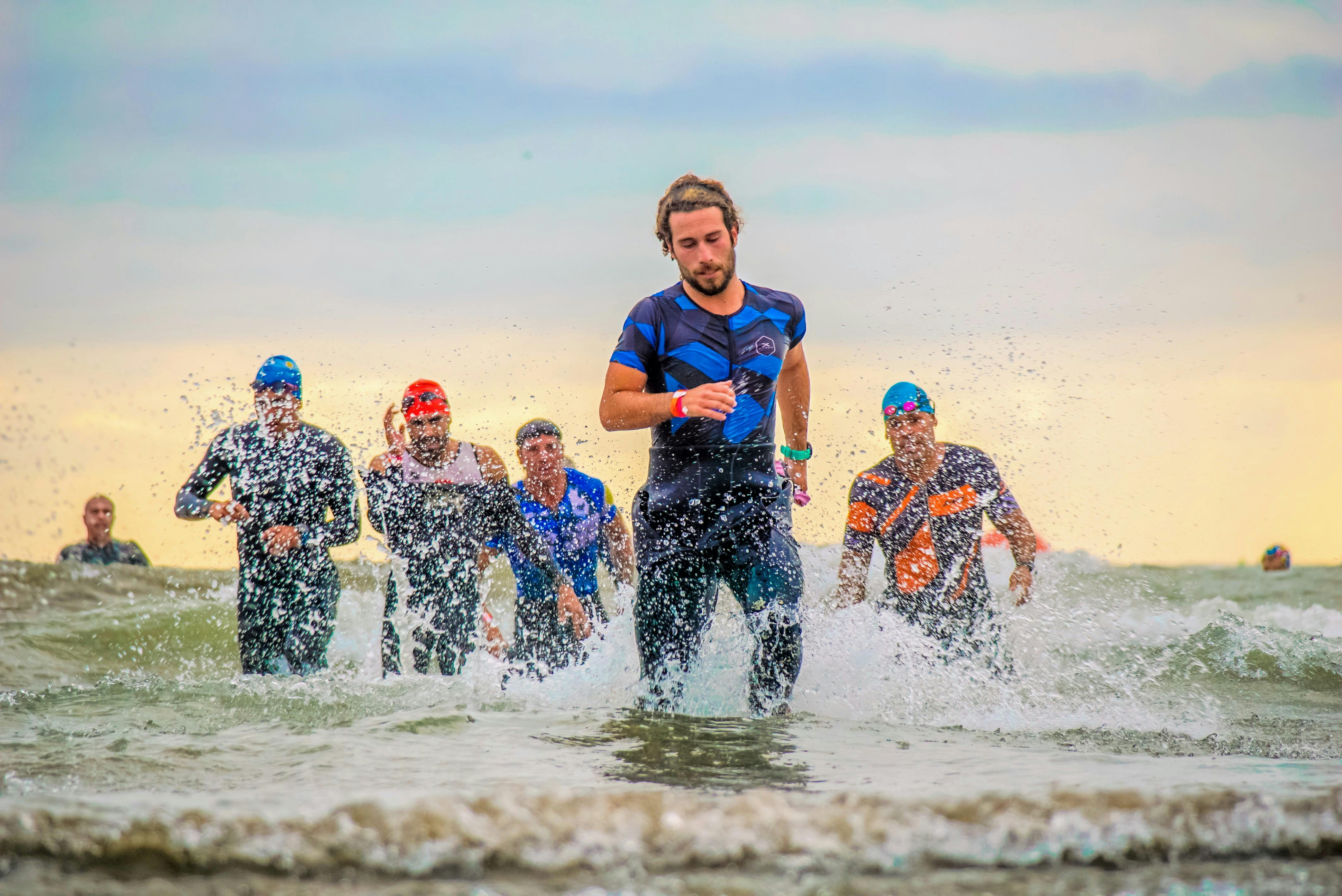 Men Running Out of Water During Triathlon · Free Stock Photo