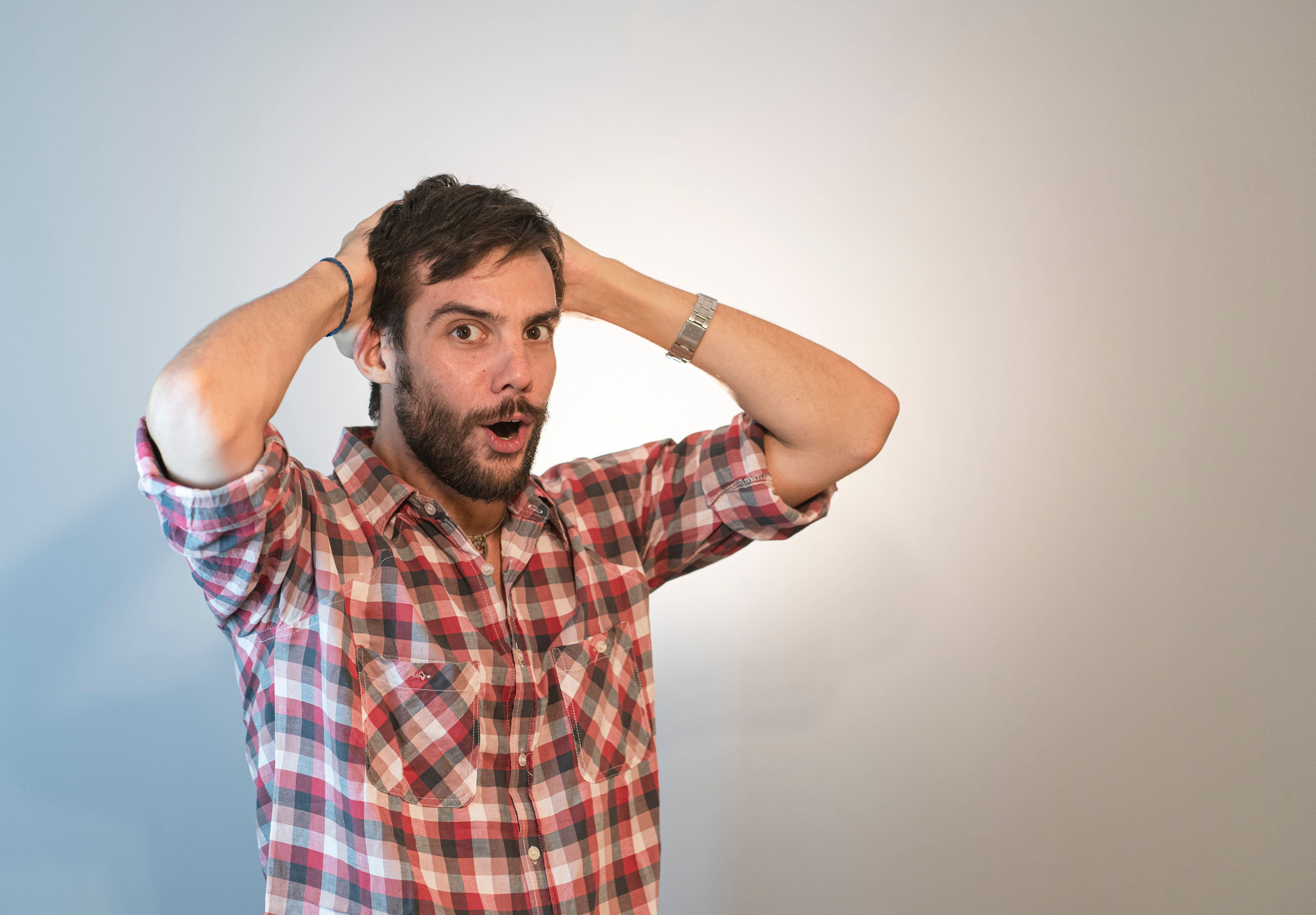 Shocked man Holding His Head · Free Stock Photo