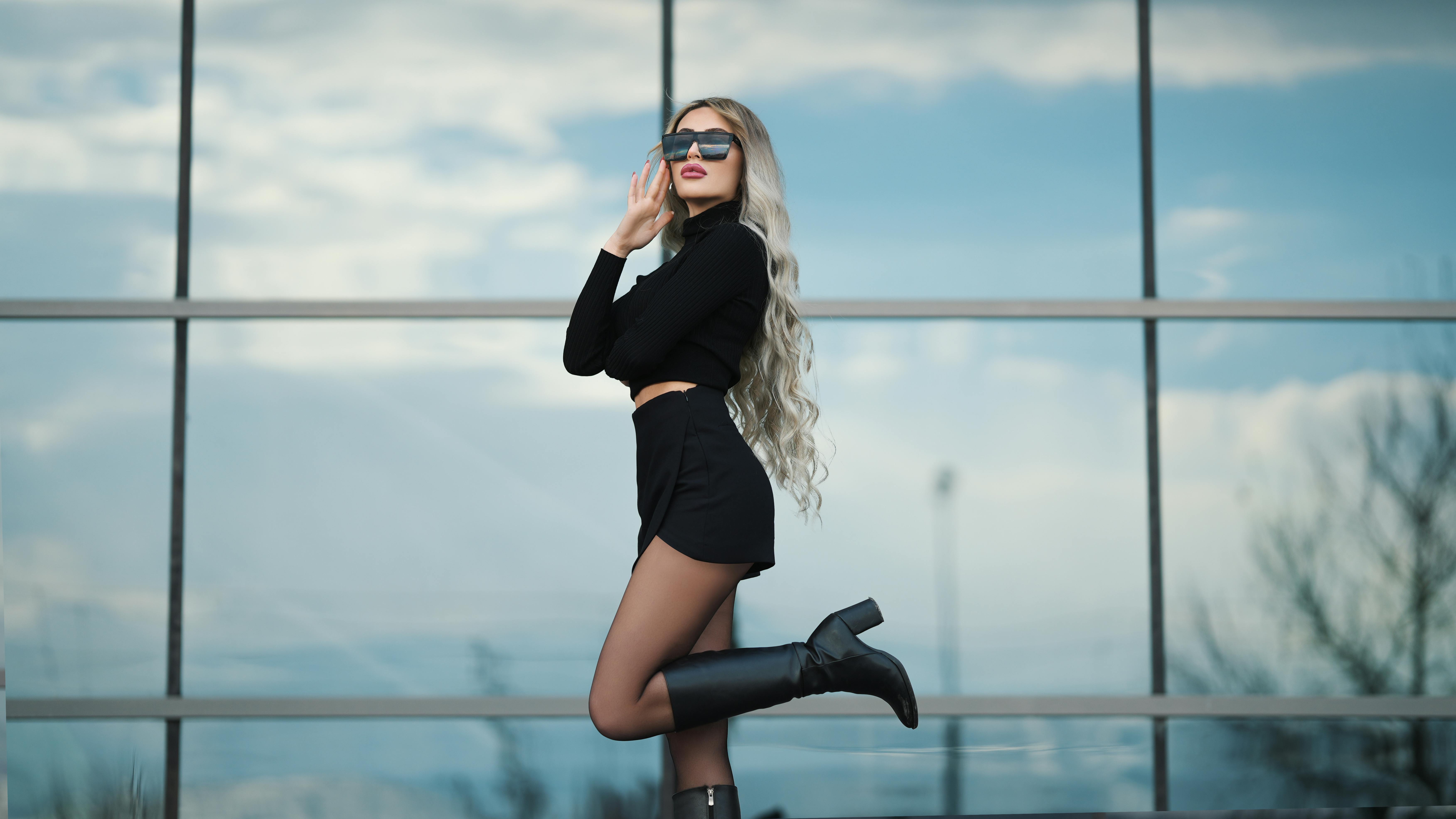 Model Leaning Against a Brick Wall · Free Stock Photo
