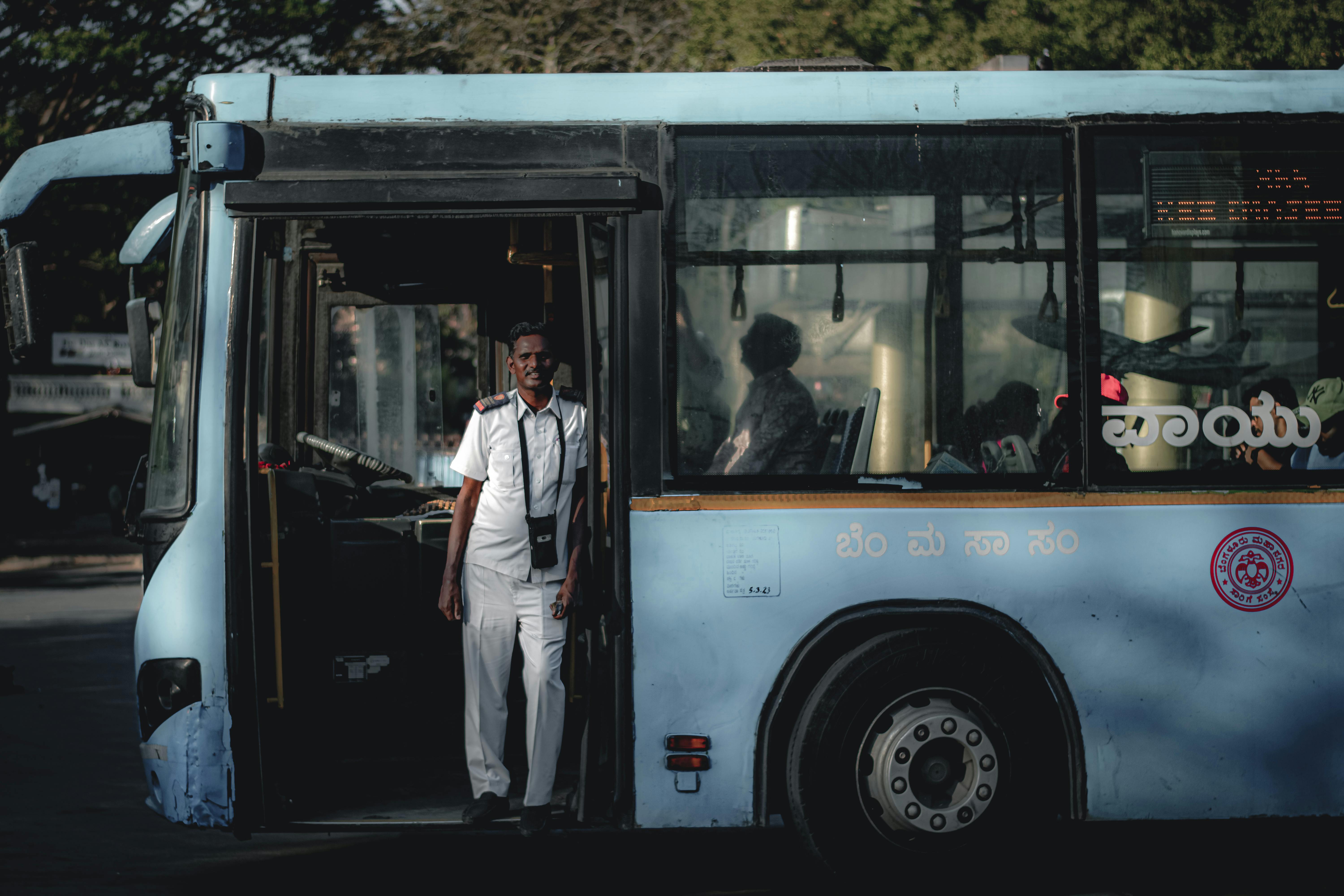 Bus Driver Standing in Door · Free Stock Photo