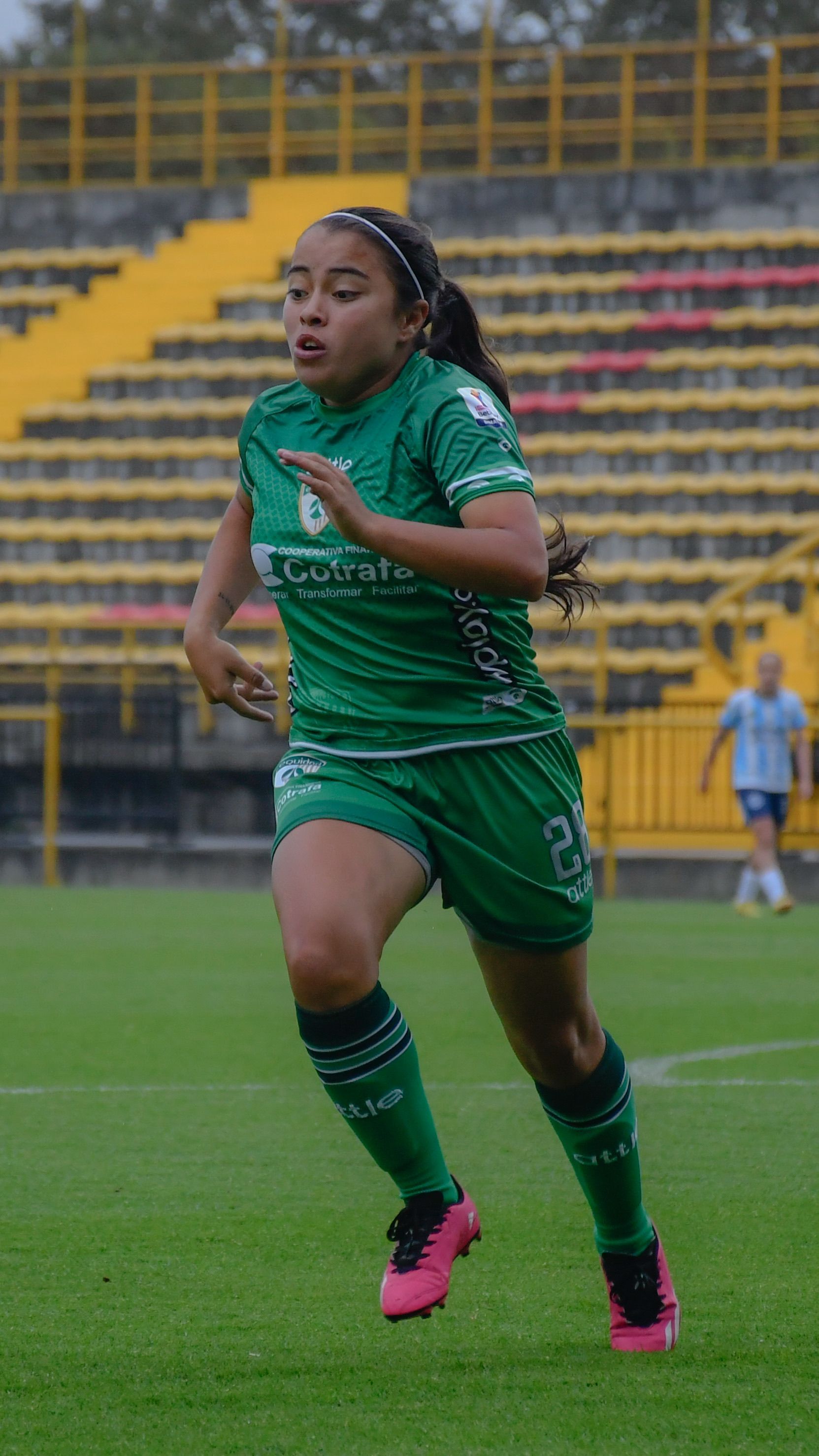 Woman Playing Football on Stadium · Free Stock Photo