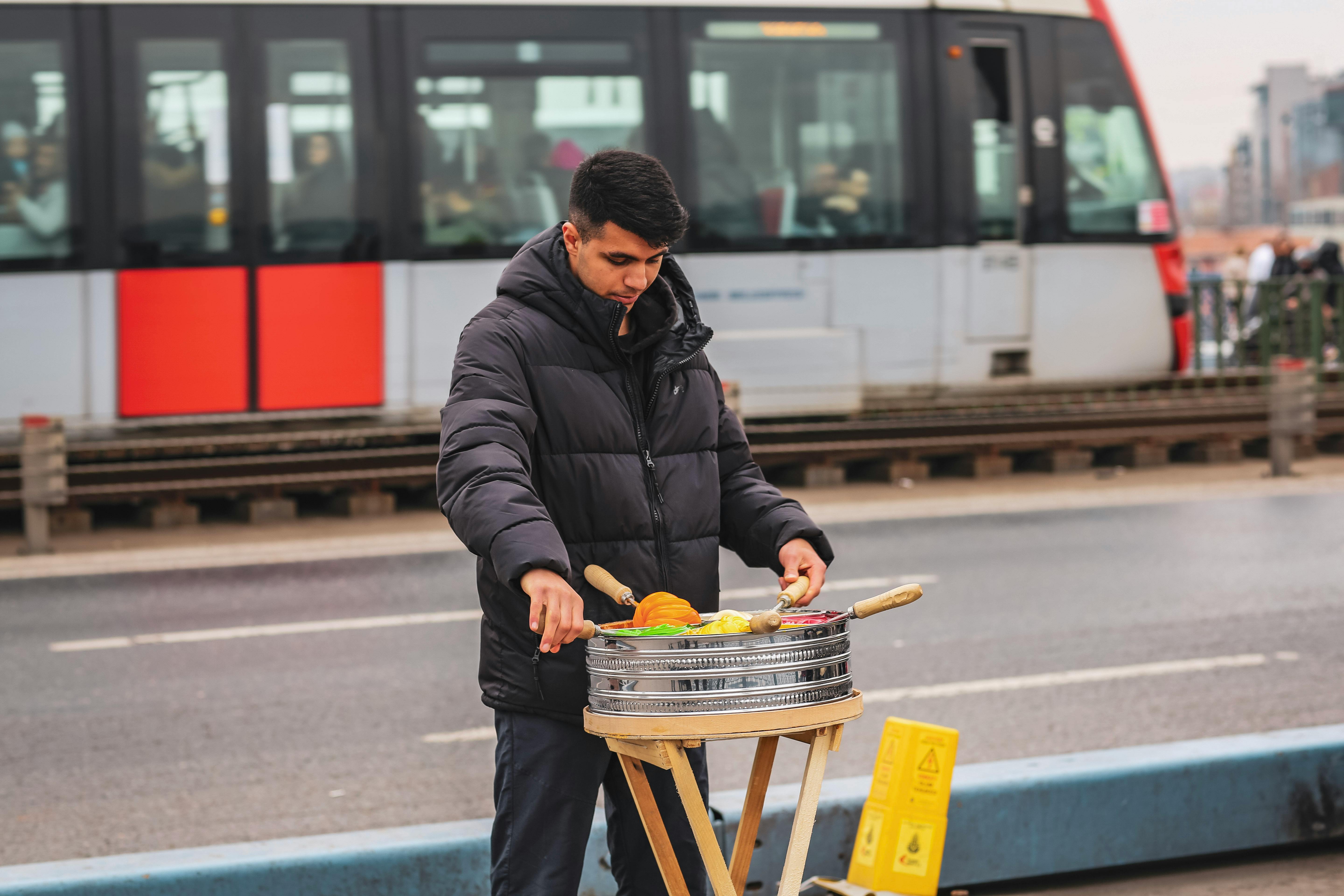 Man Making Food on a City Street · Free Stock Photo