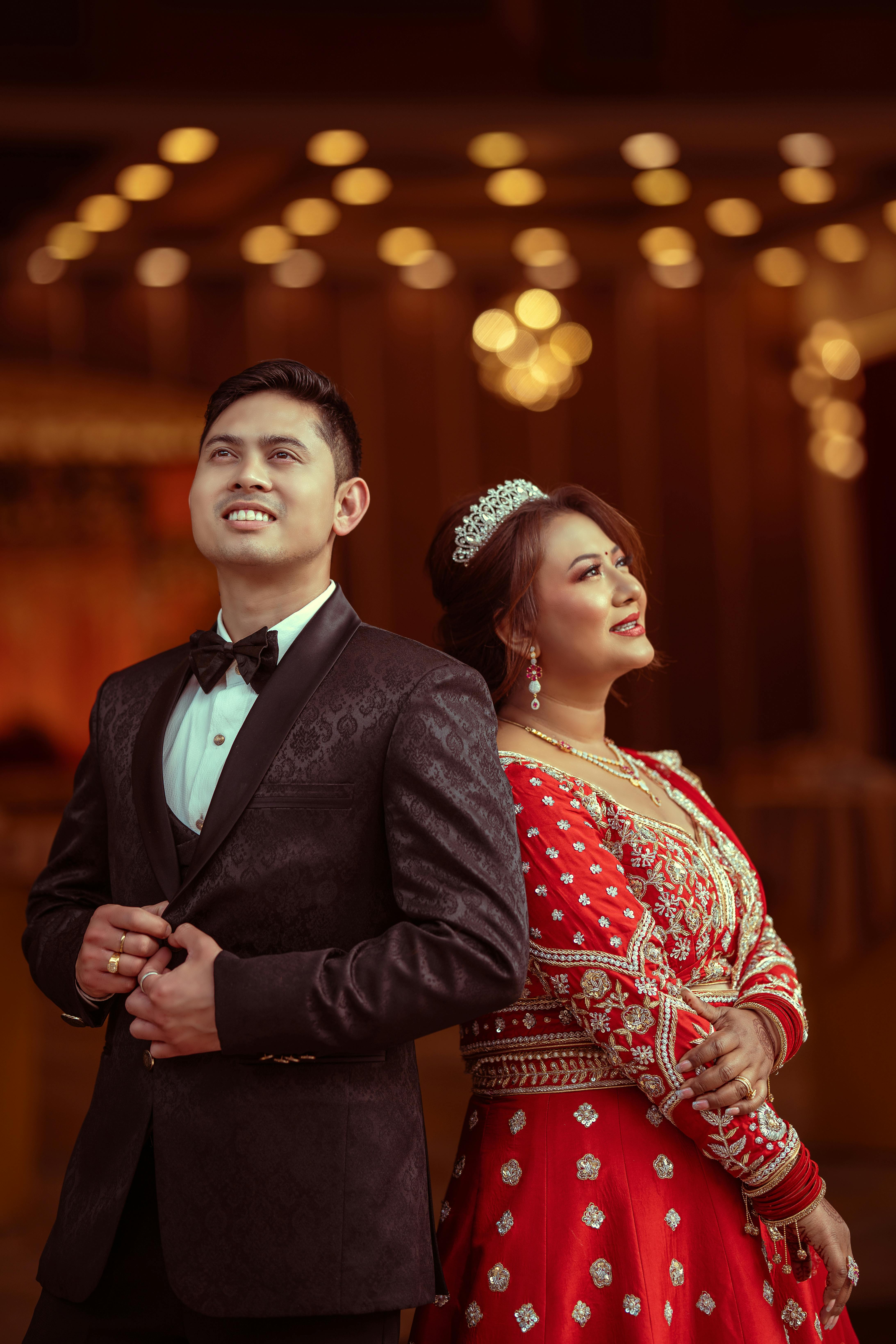 Elegant Couple Posing Back to Back · Free Stock Photo