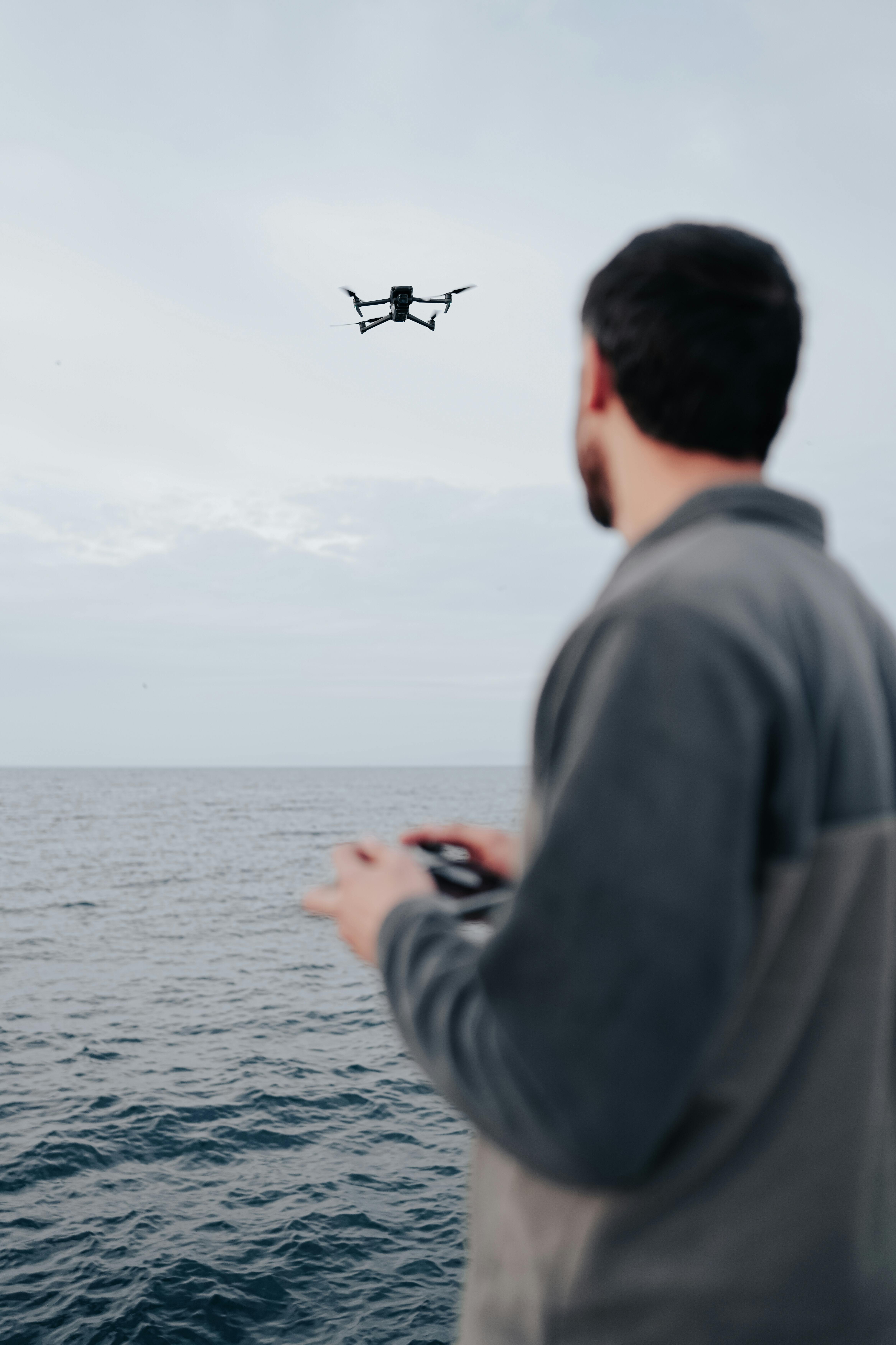 Man Controlling Drone in Air · Free Stock Photo