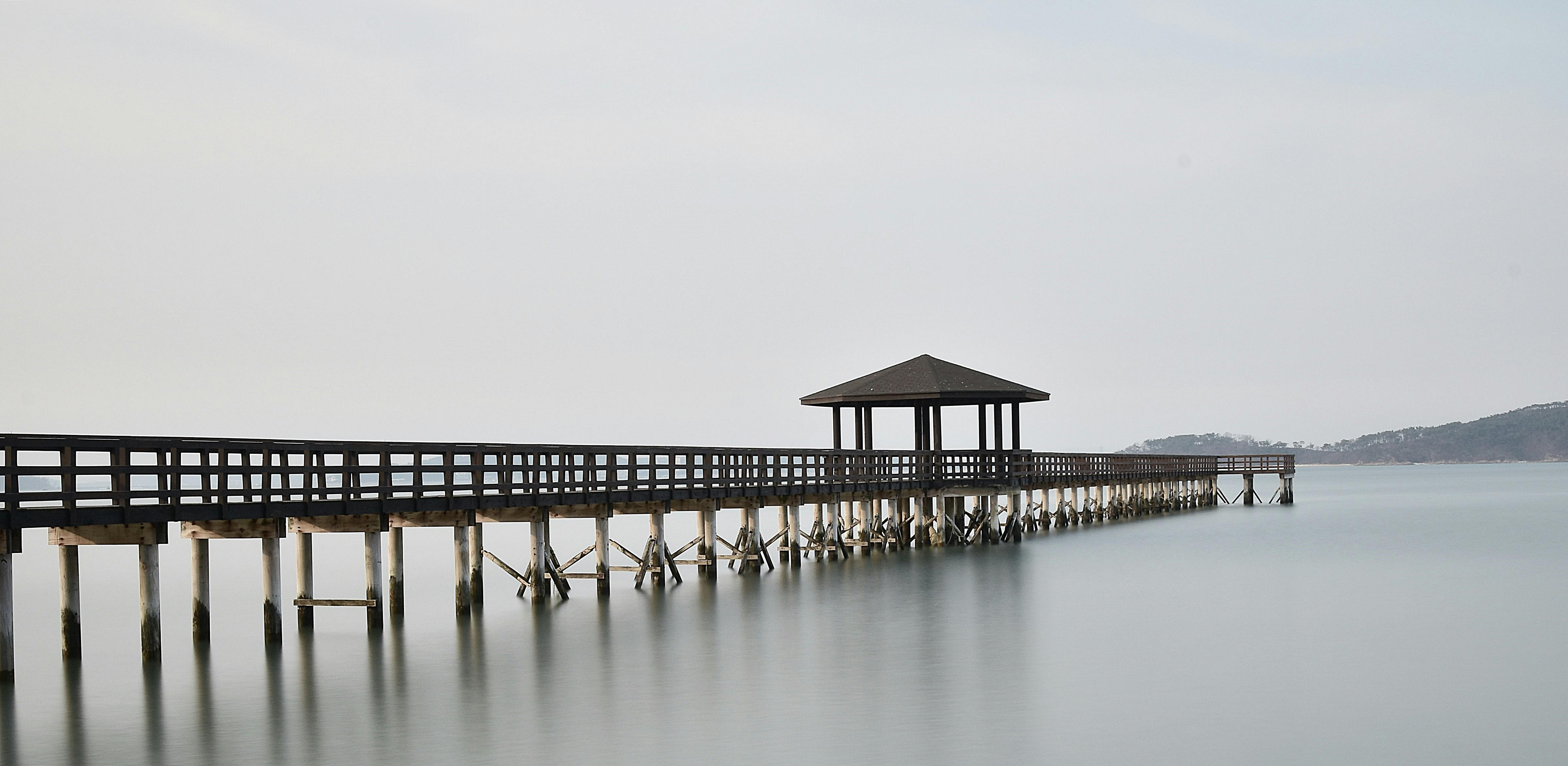 Scenic Photo of a Long Wooden Pier · Free Stock Photo