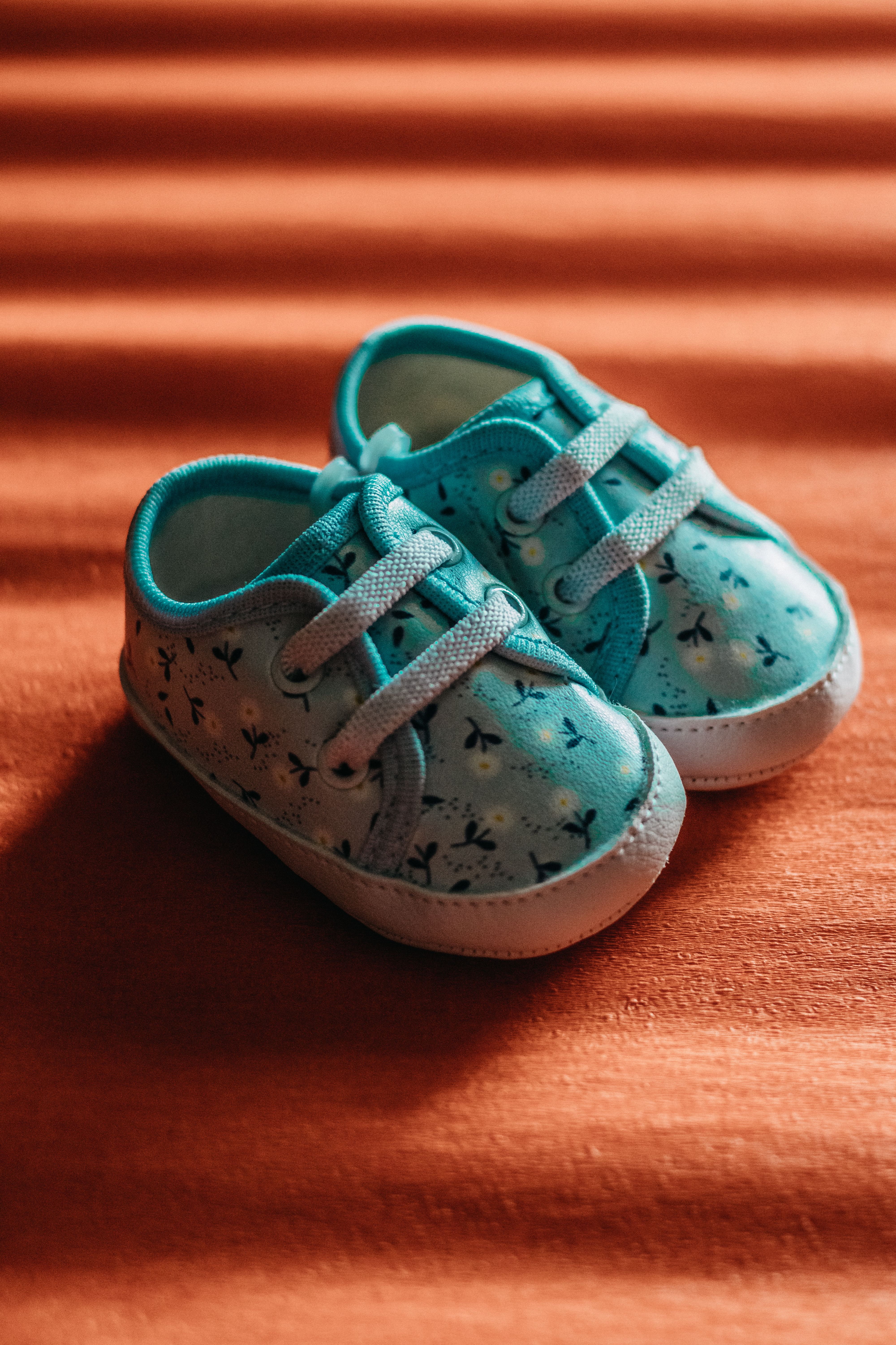 Close-up of Tiny Baby Shoes with Cheetah Print Standing on the Grass ...
