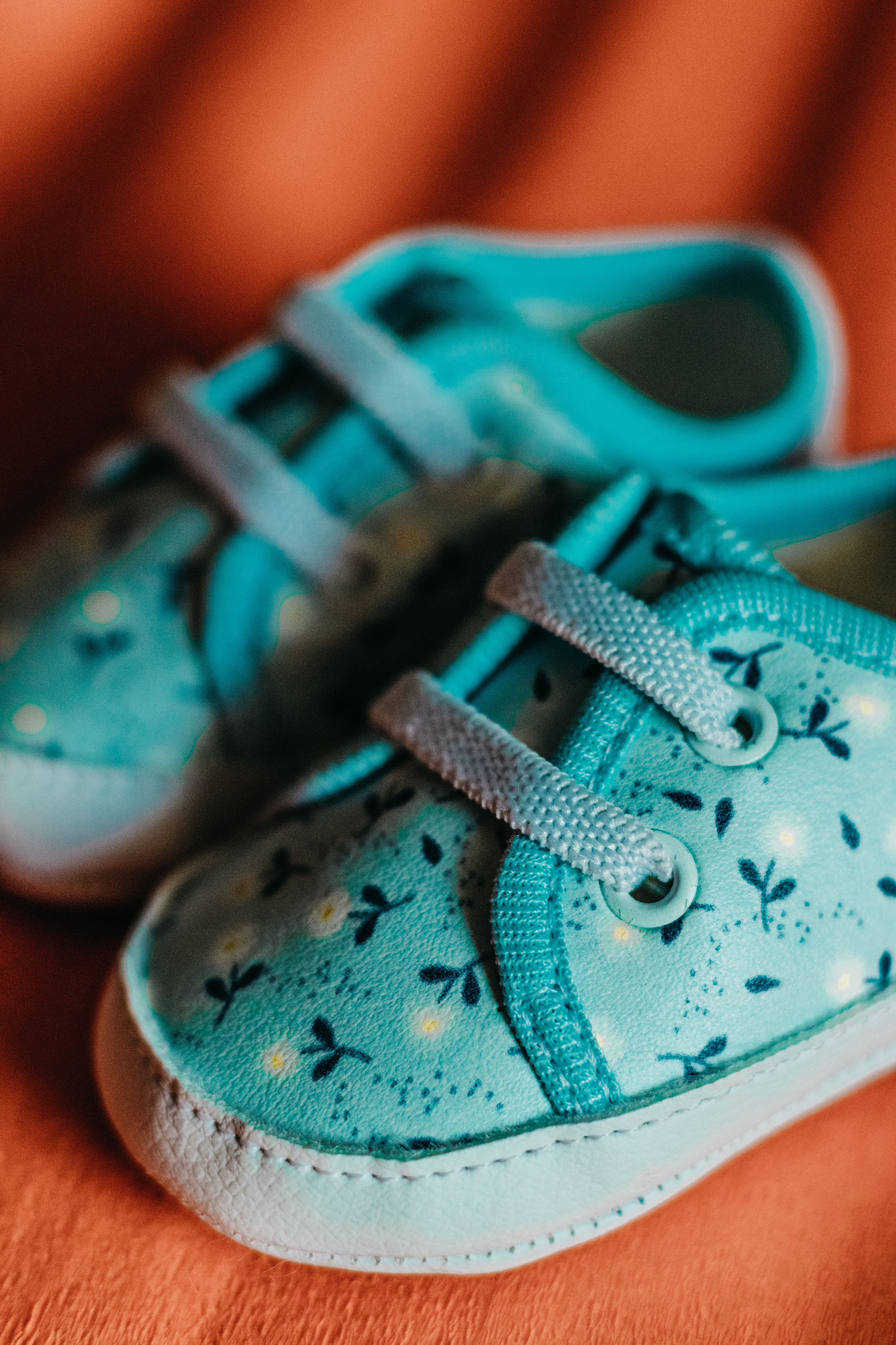 Close-up of Tiny Baby Shoes with Cheetah Print Standing on the Grass ...