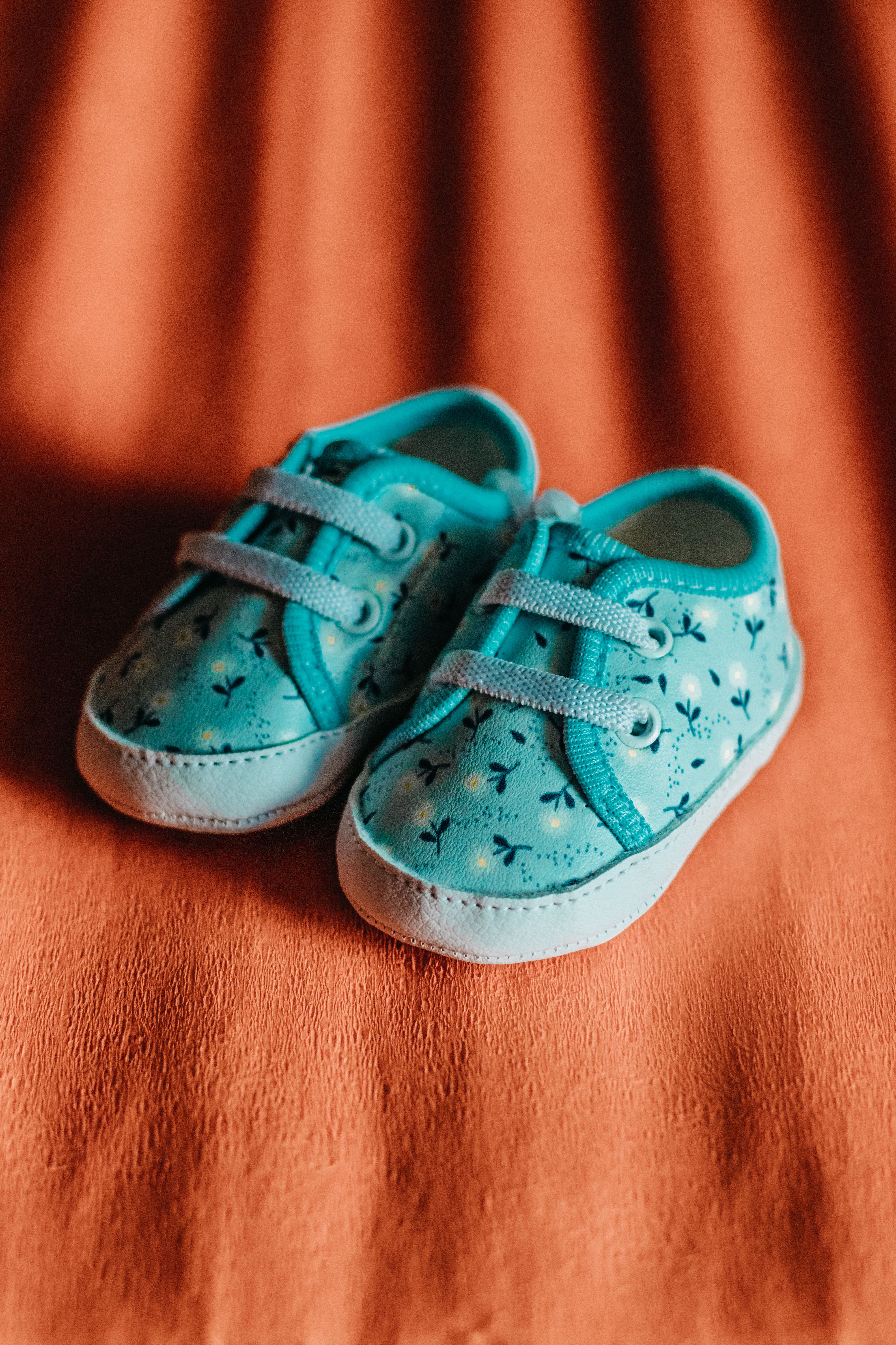 Close-up of Tiny Baby Shoes with Cheetah Print Standing on the Grass ...