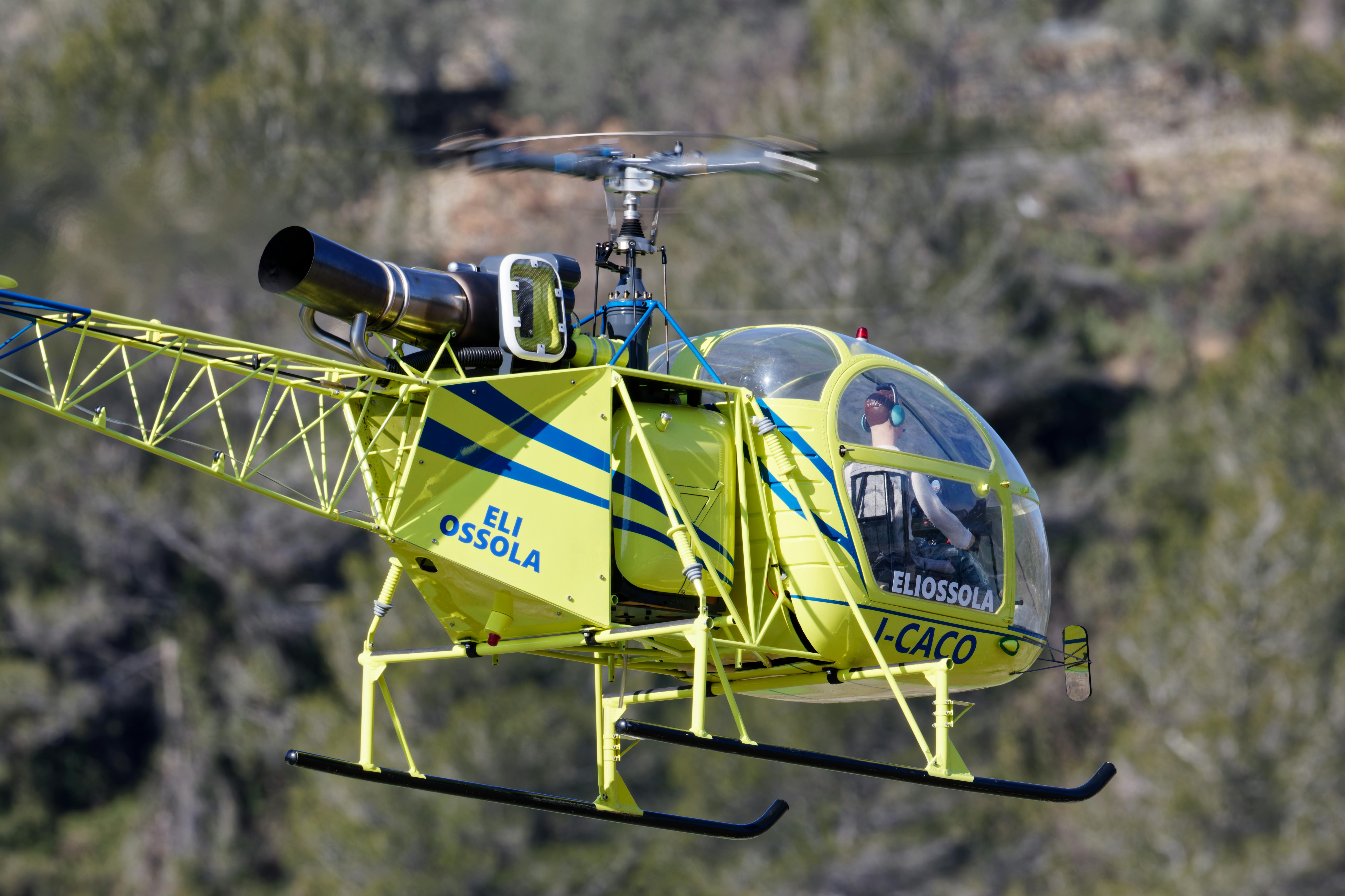 Person Flying a Helicopter · Free Stock Photo