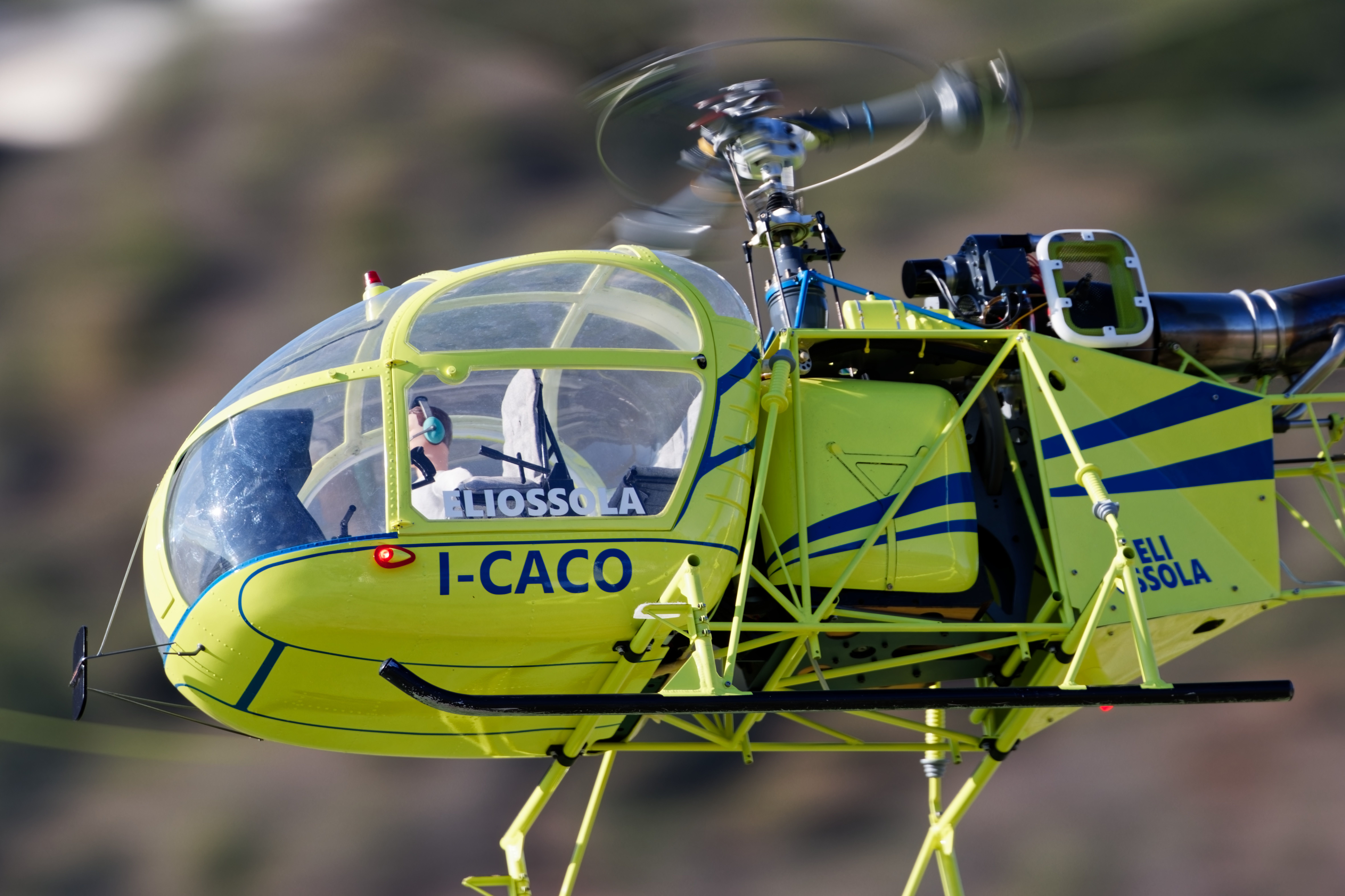Flying Neon Colored Toy Helicopter · Free Stock Photo
