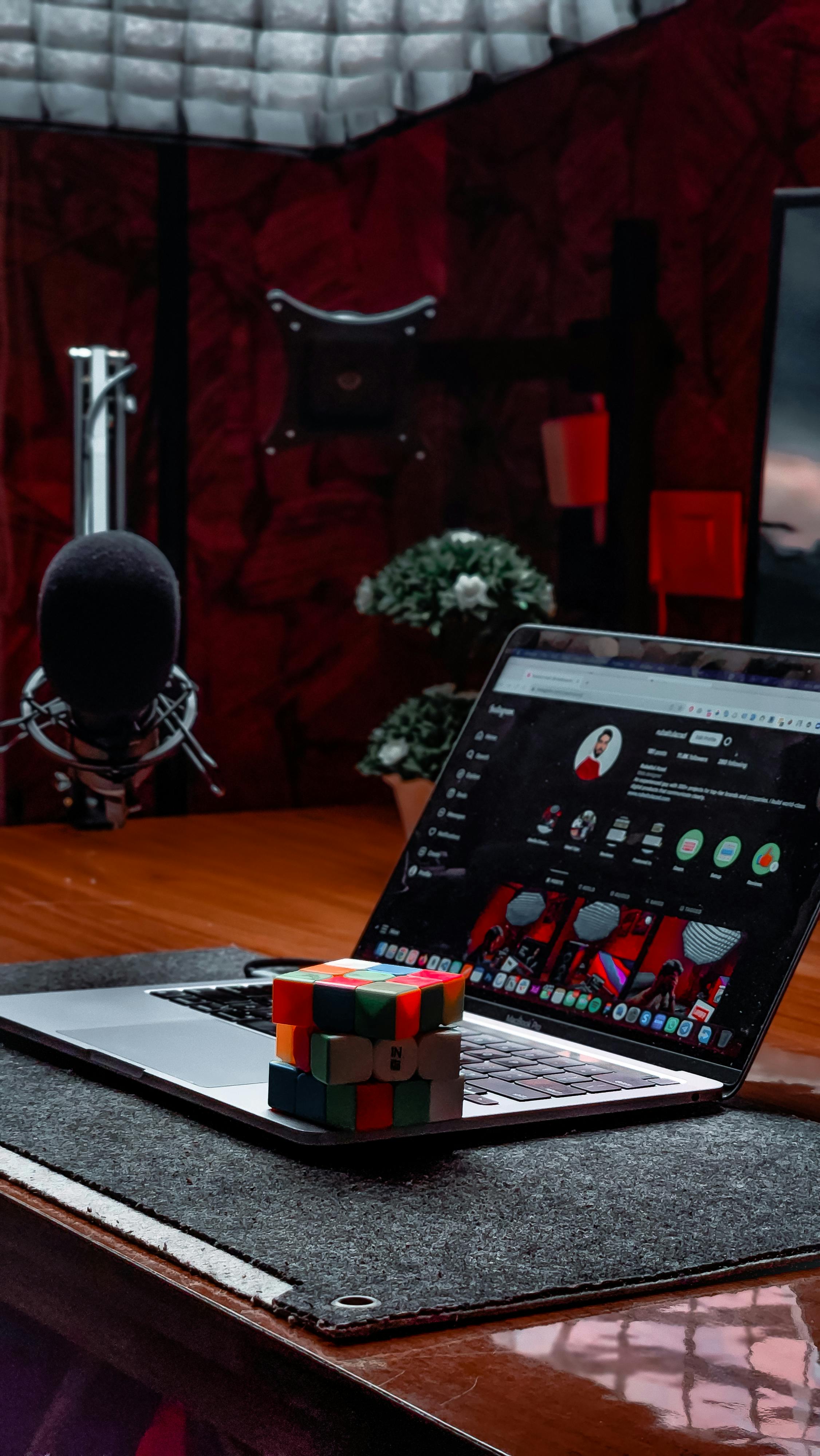 Unlocking the Mysteries of Rubik's Cube on Studio Laptop · Free Stock Photo