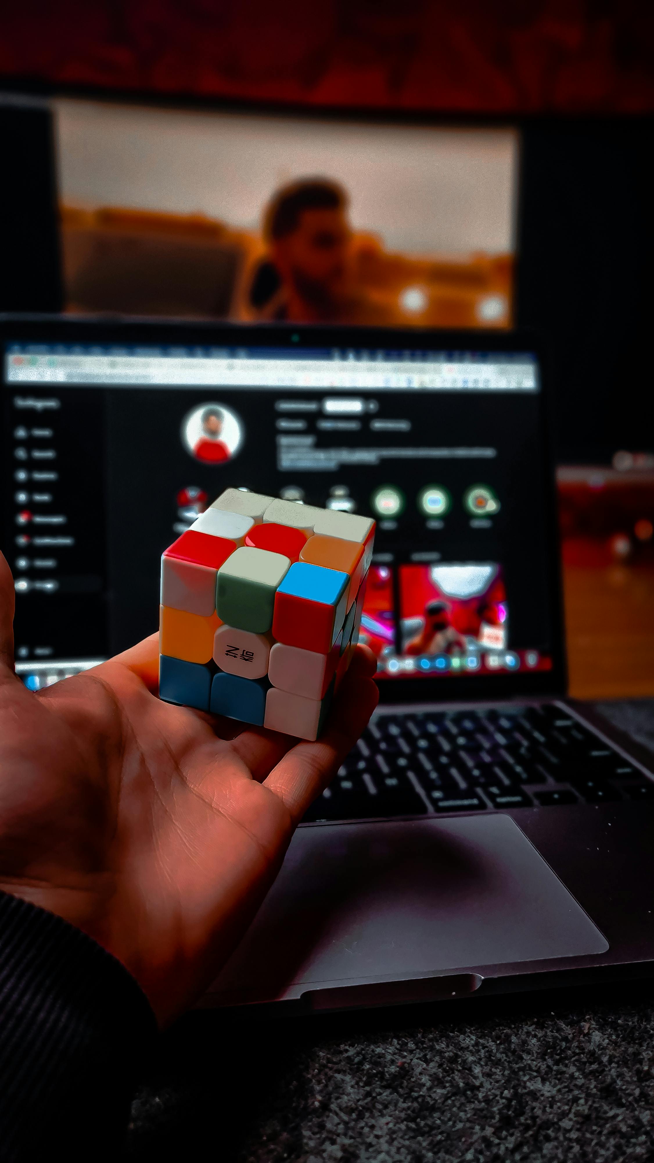 Unlocking the Mysteries of Rubik's Cube on Studio Laptop · Free Stock Photo
