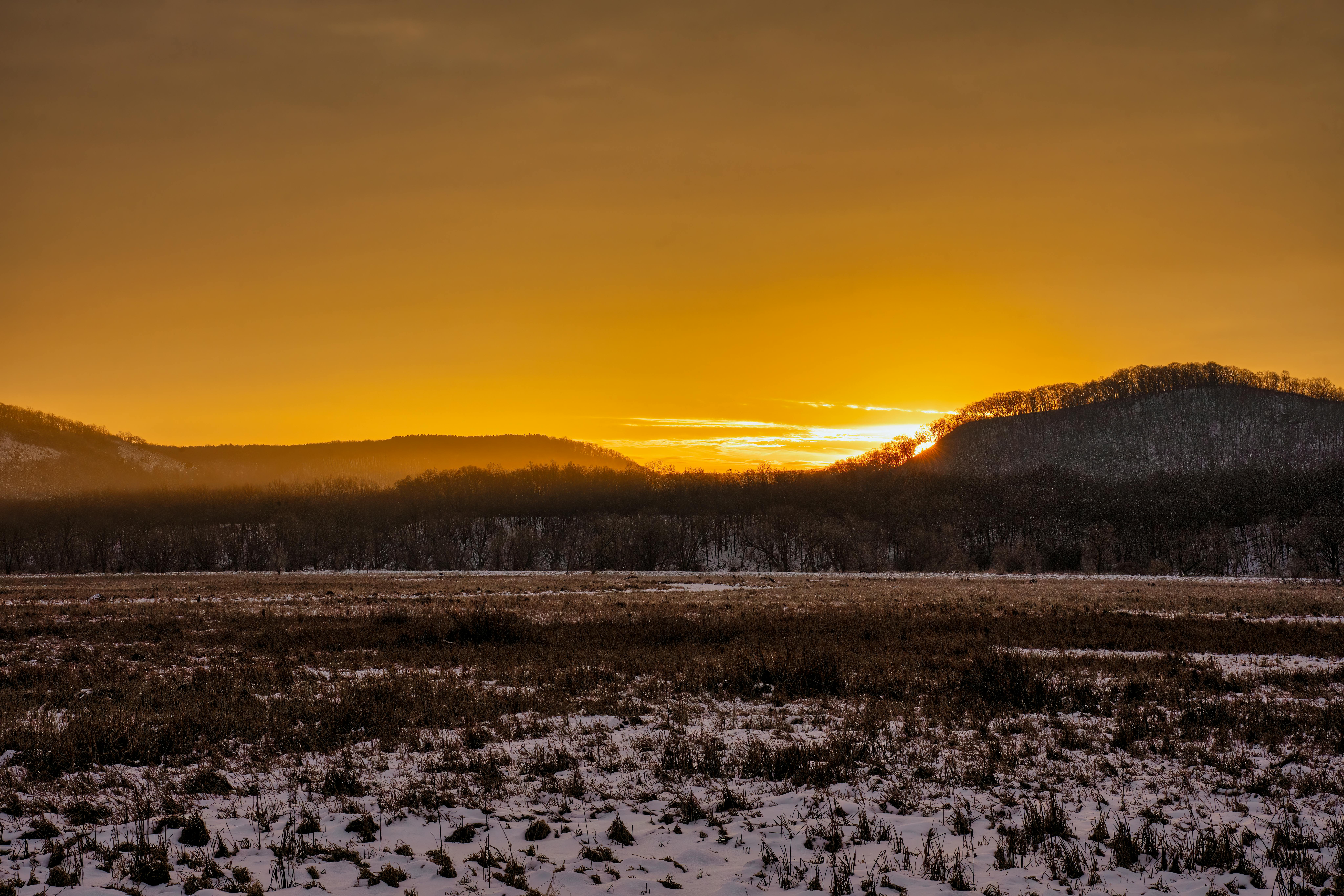 Sunset Behind Mountain Seen From Plain · Free Stock Photo