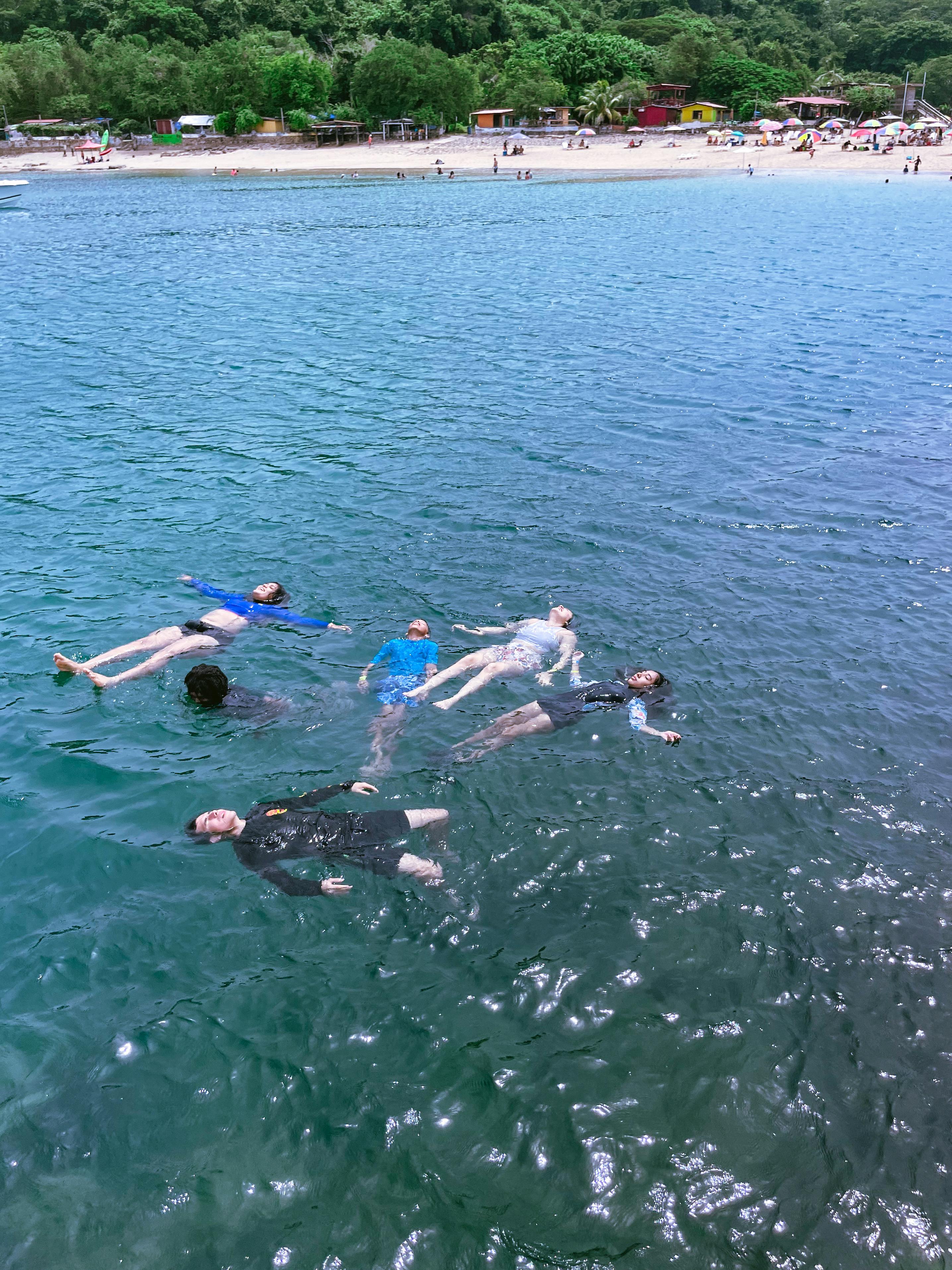 Photo of People Floating on the Sea Water · Free Stock Photo