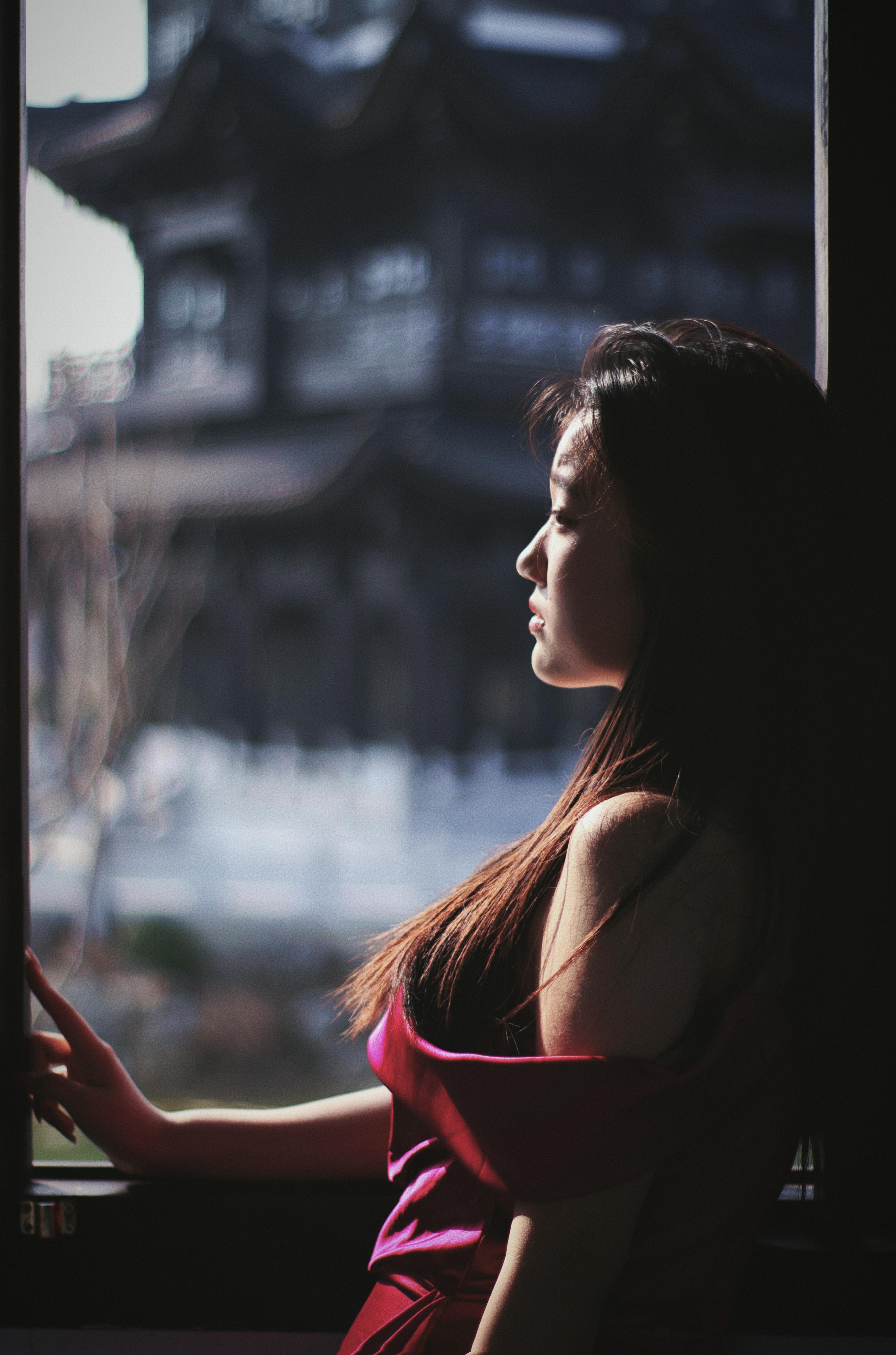 Beautiful Woman Looking out the Window · Free Stock Photo