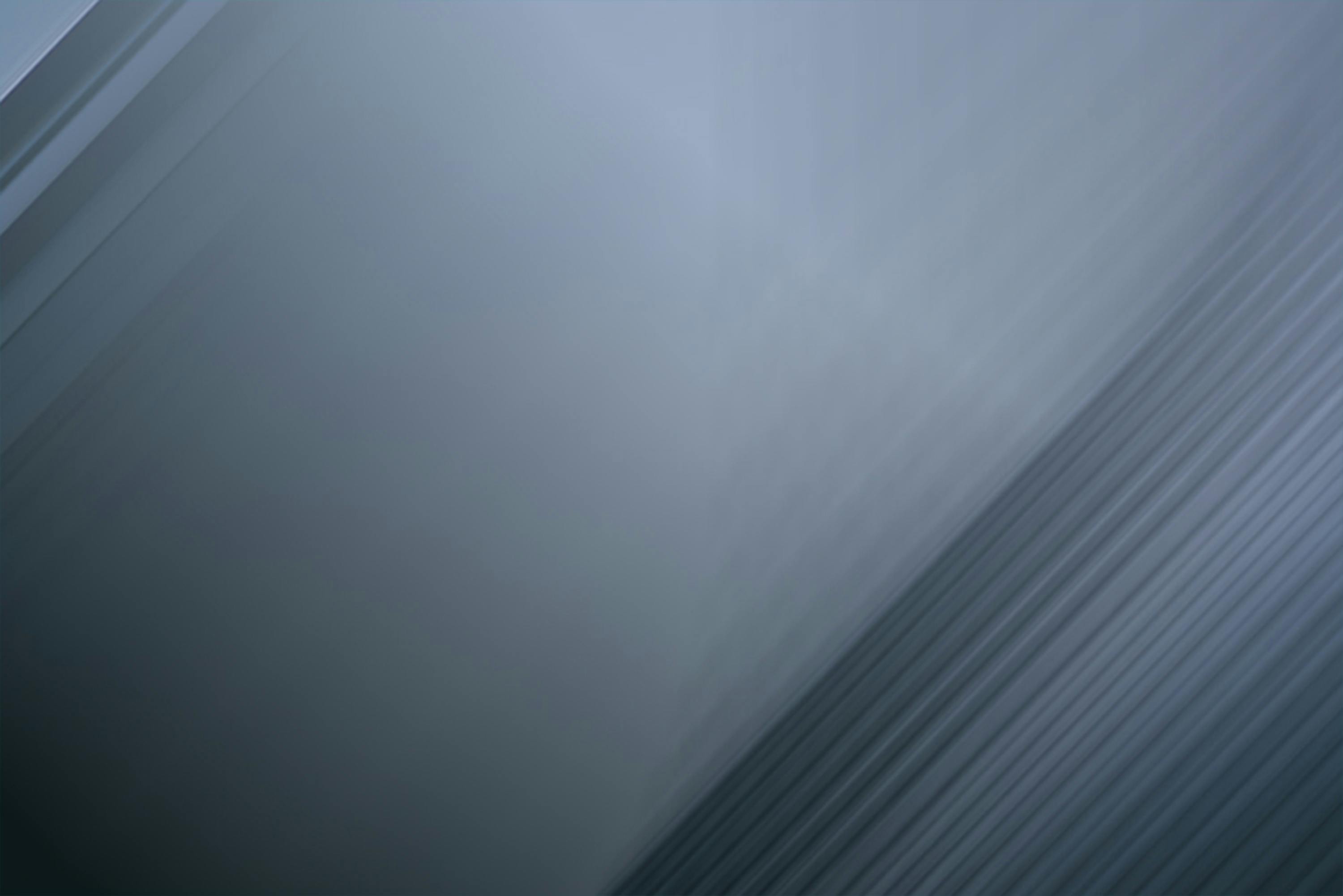 Gray Geometric Shadows on a White Building Wall · Free Stock Photo