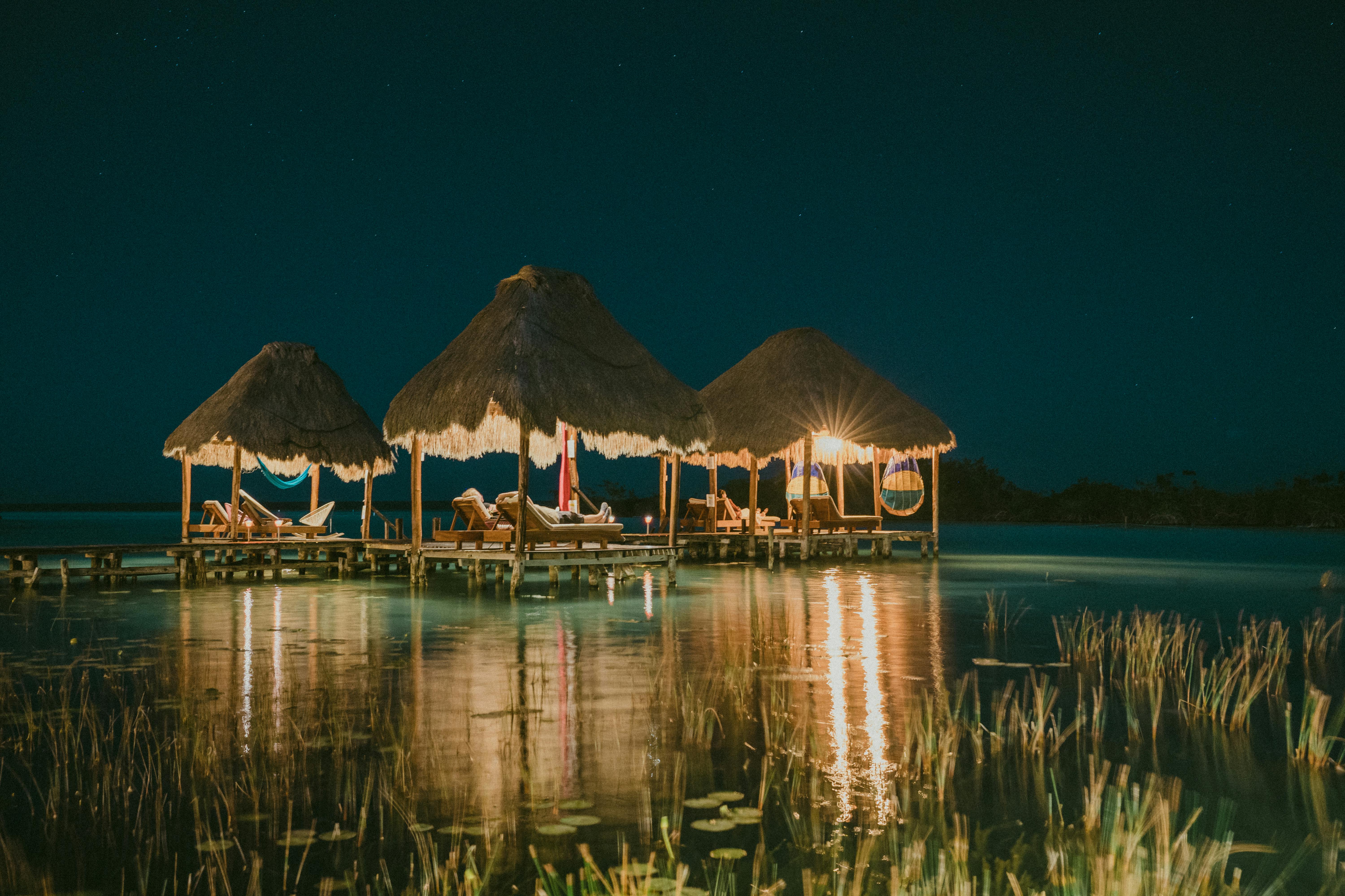 Illuminated Gazebos in Water in Exotic Landscape · Free Stock Photo