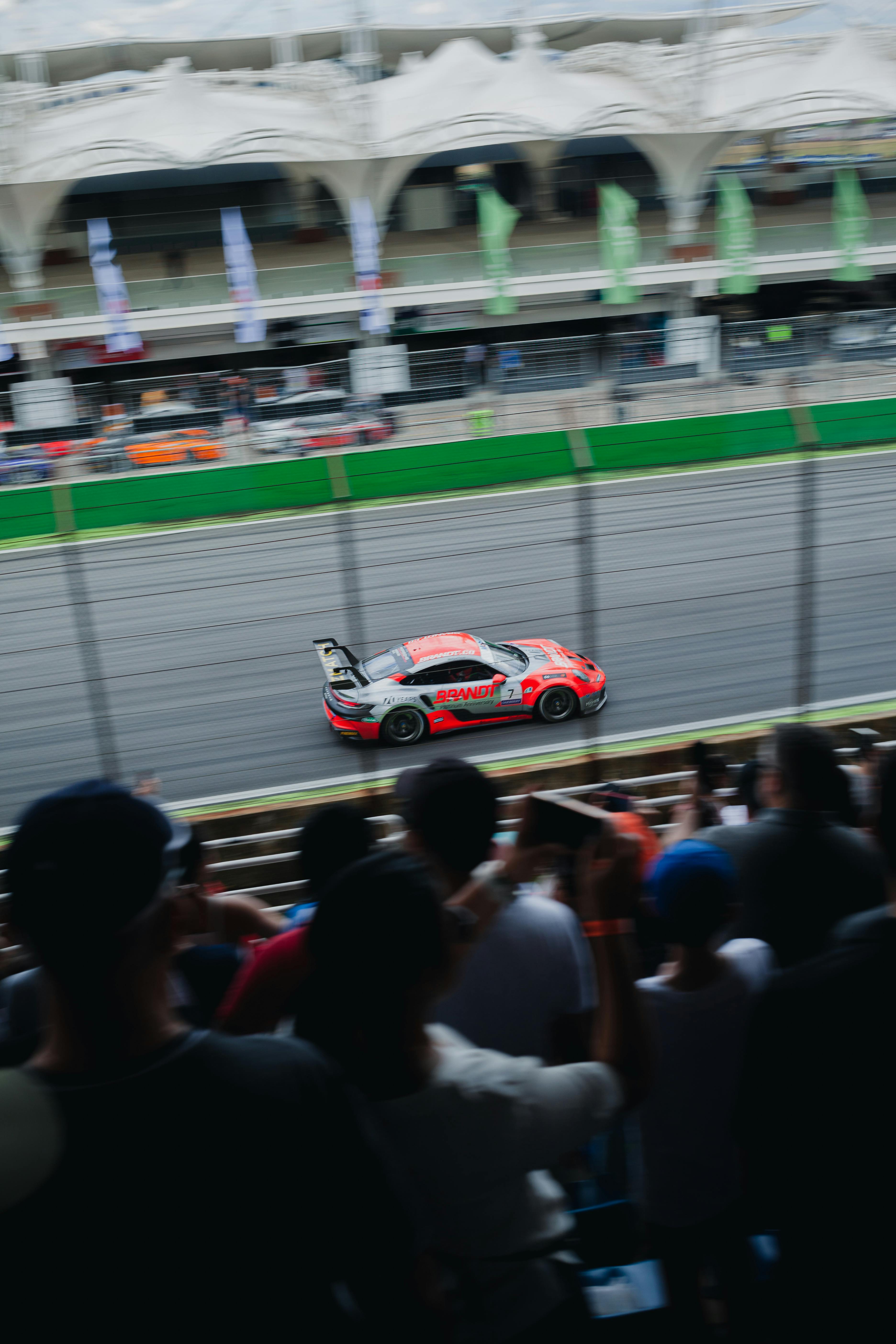 Crowd on Stand and Racing Car on Circuit · Free Stock Photo