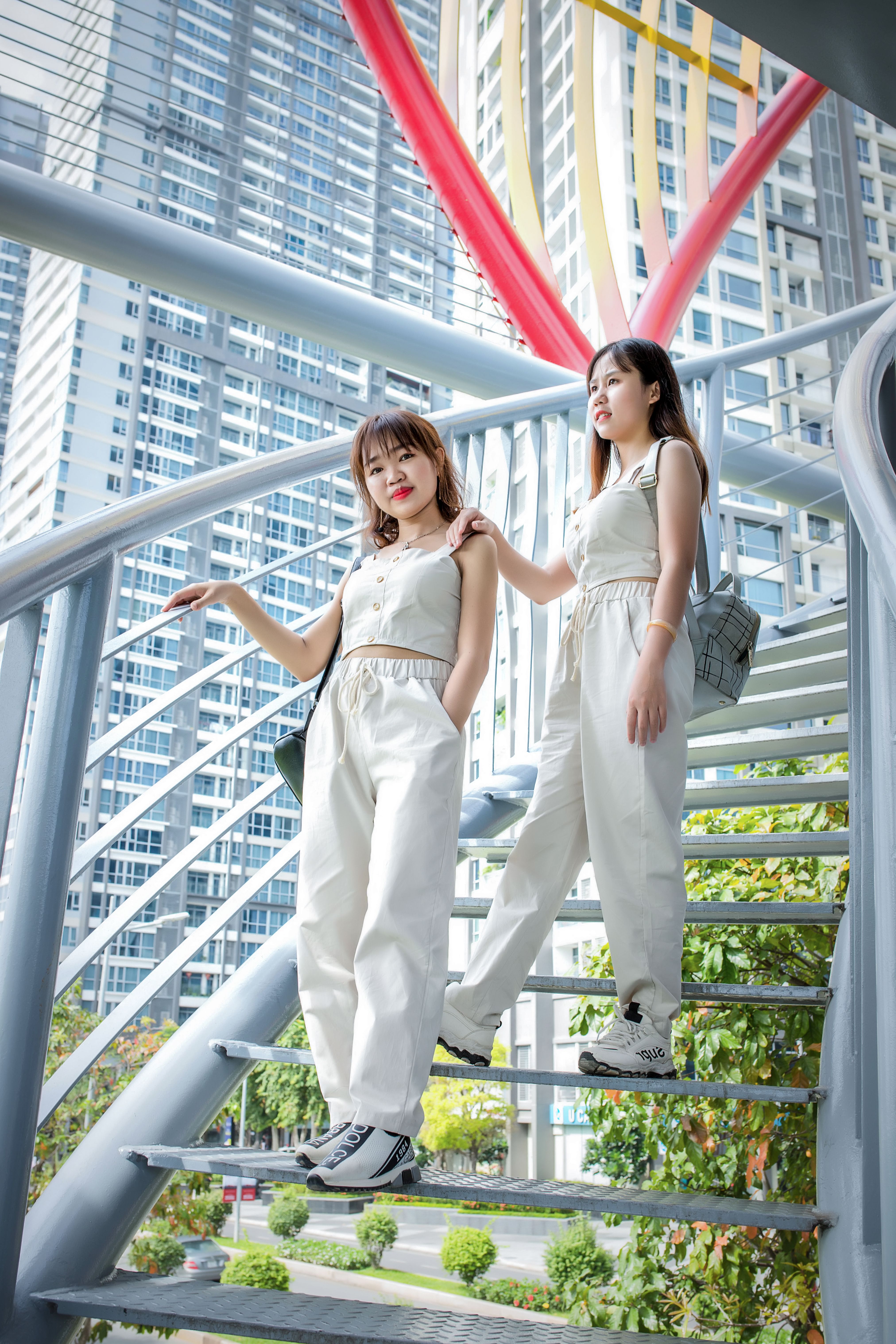 Two Young Women Standing on Steps in the Center of Ho Chi Minh City ...